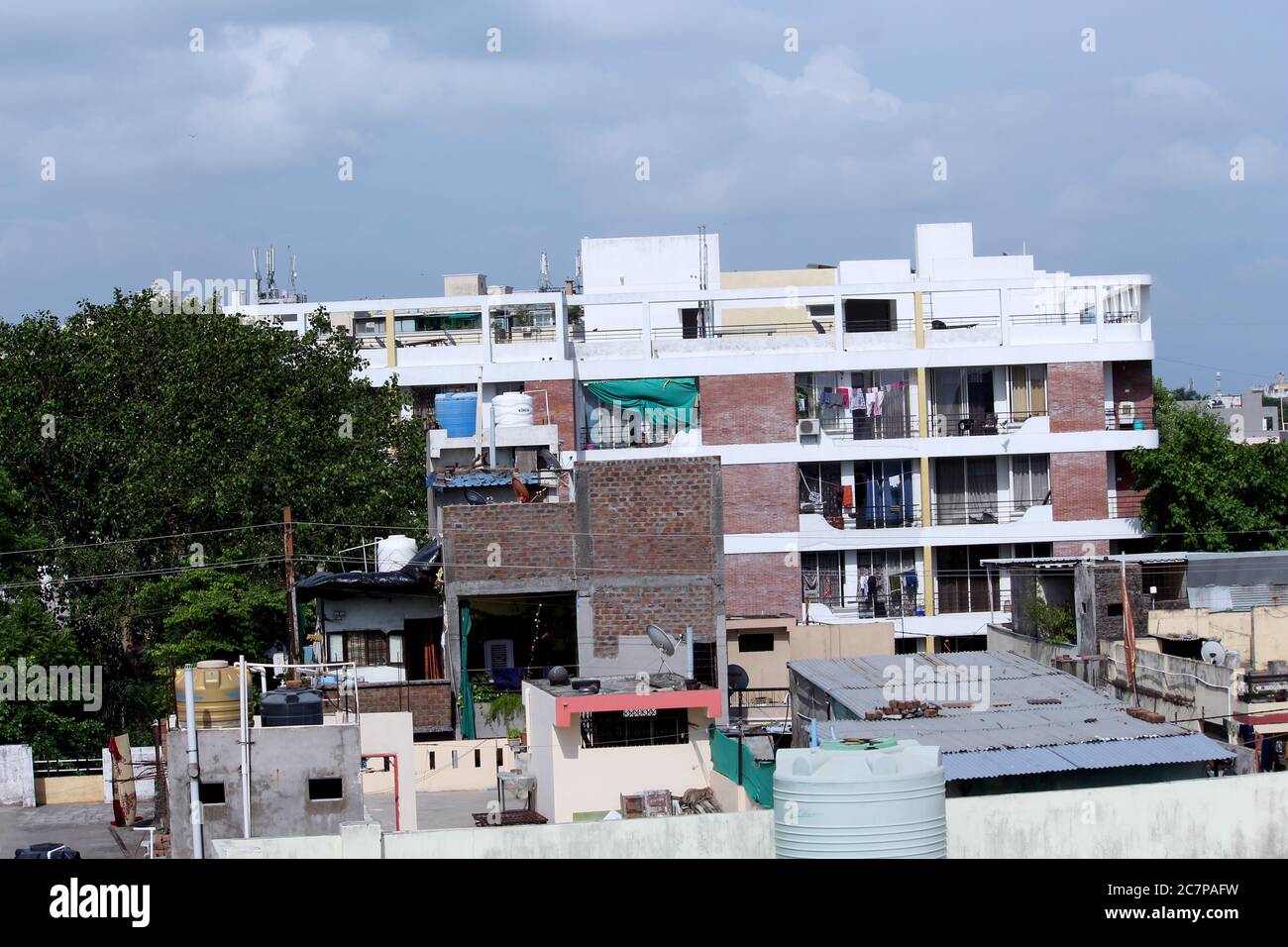 residential buildings and houses in city, Indian street sky background ...