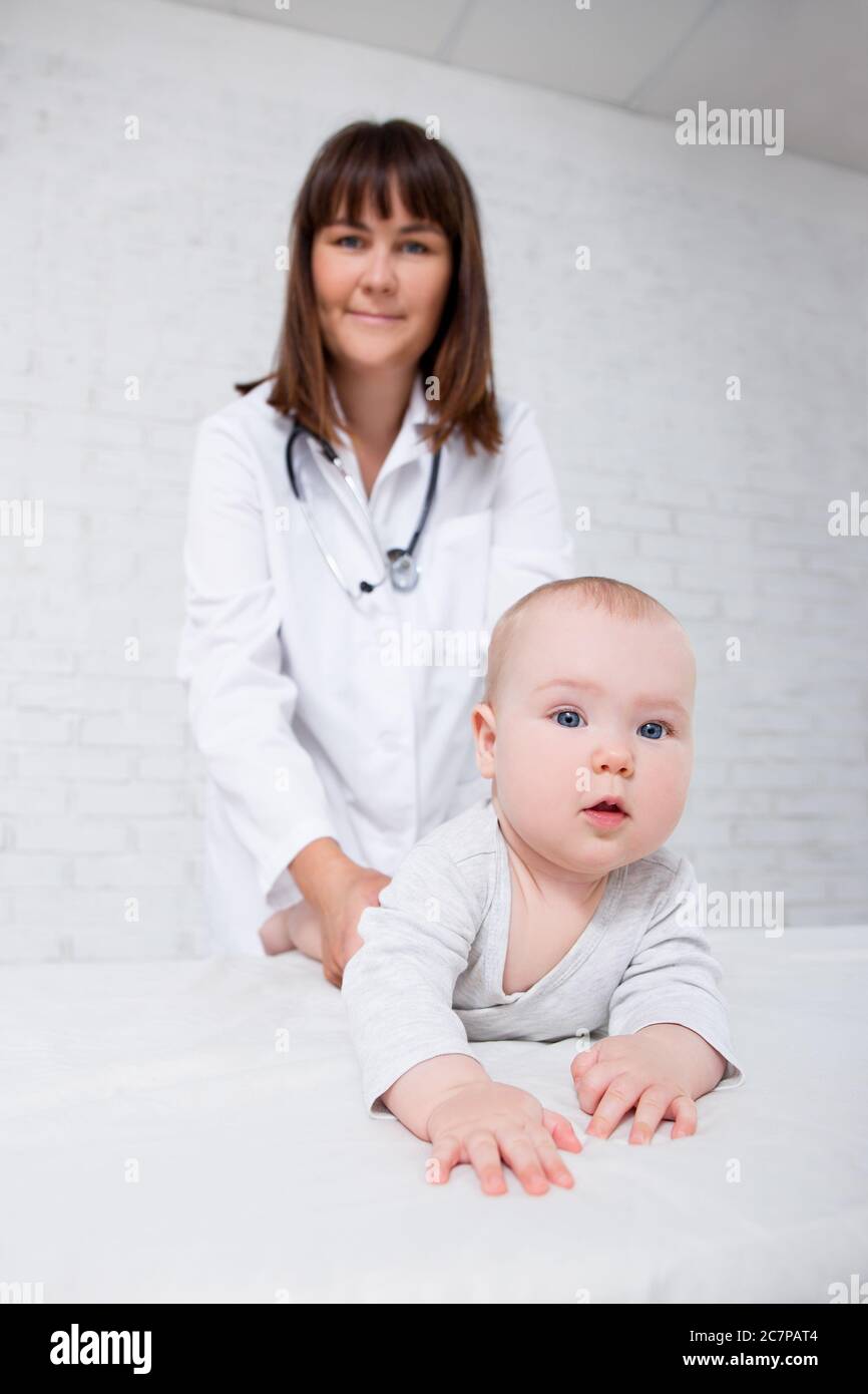 cute little baby with young female doctor pediatrician Stock Photo - Alamy