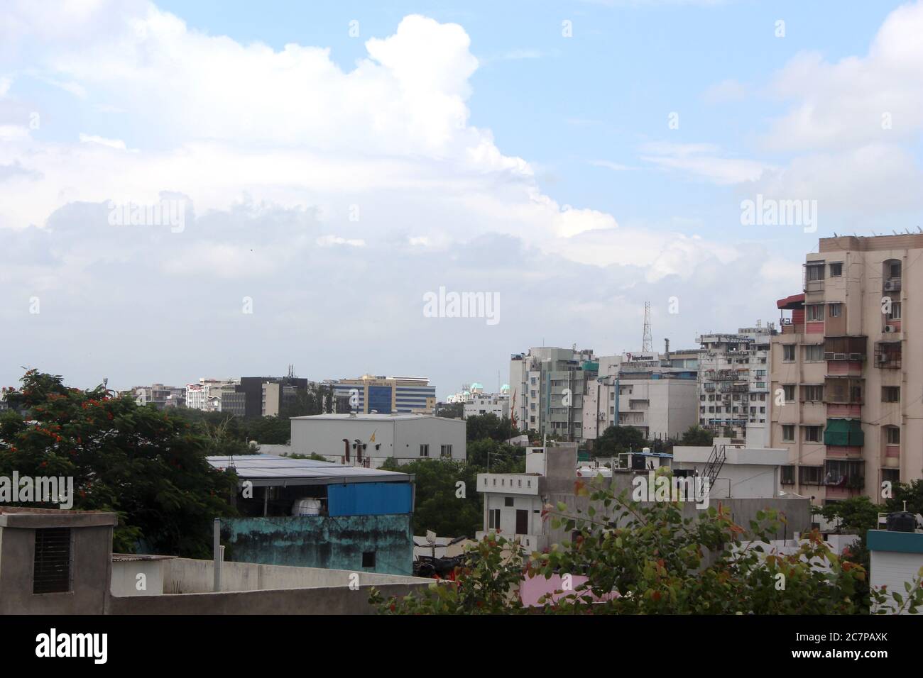 residential buildings and houses in city, Indian street sky background ...