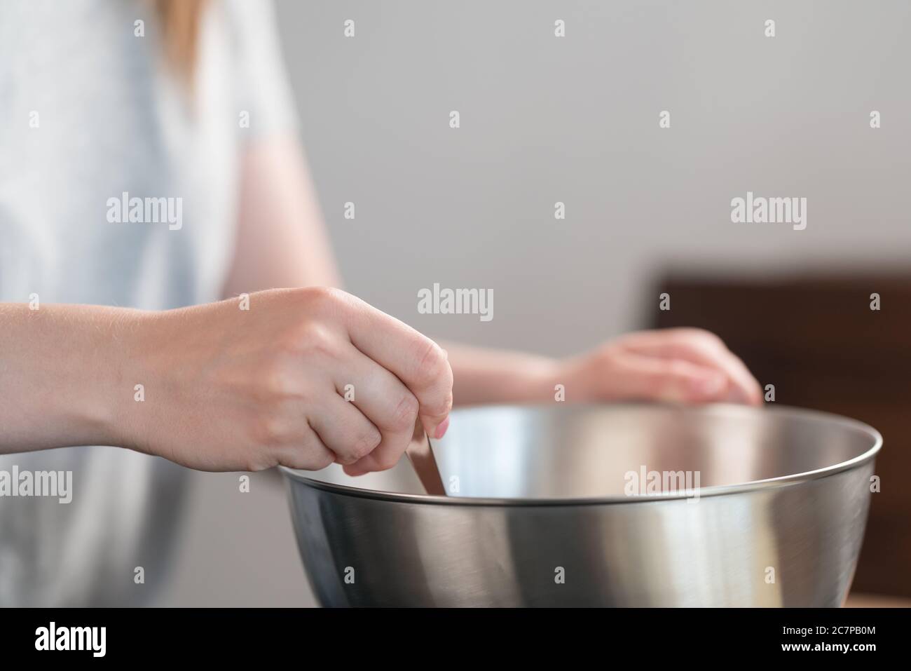 young woman mixing chocolate in steel bowl to make candys Stock Photo ...