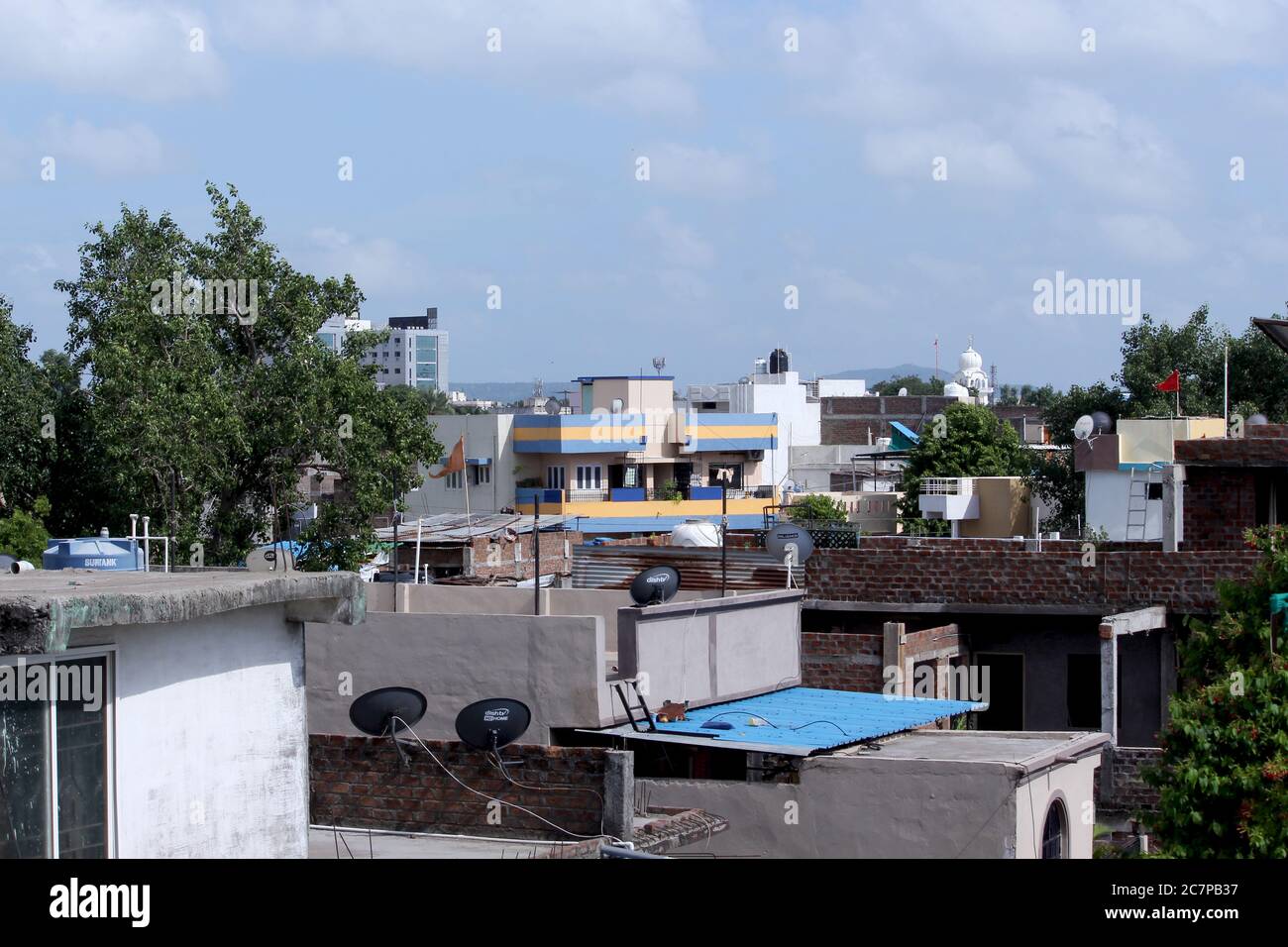 residential buildings and houses in city, Indian street sky background ...