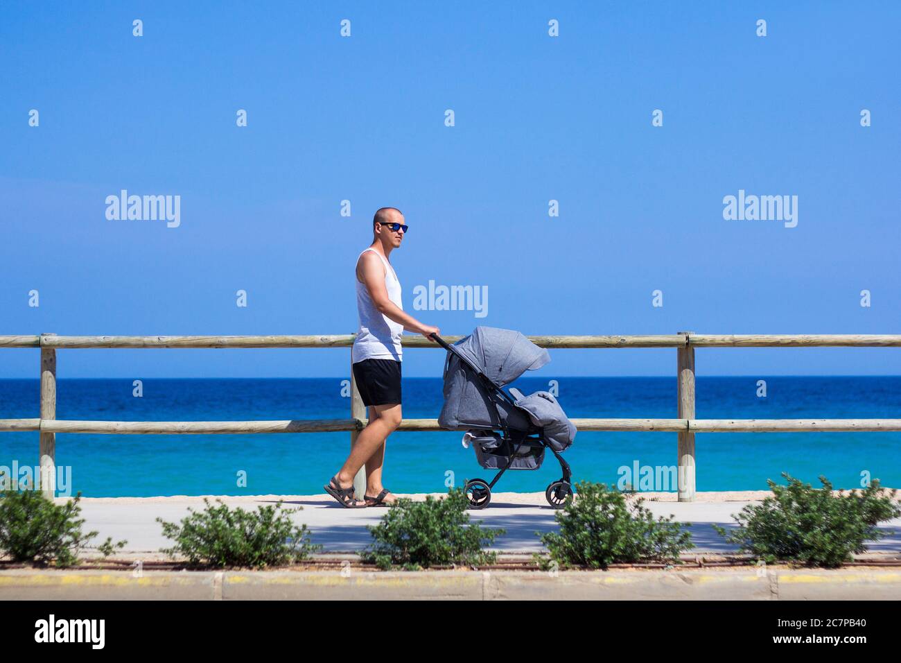 Man Pushing Pram On Beach High Resolution Stock Photography and Images ...