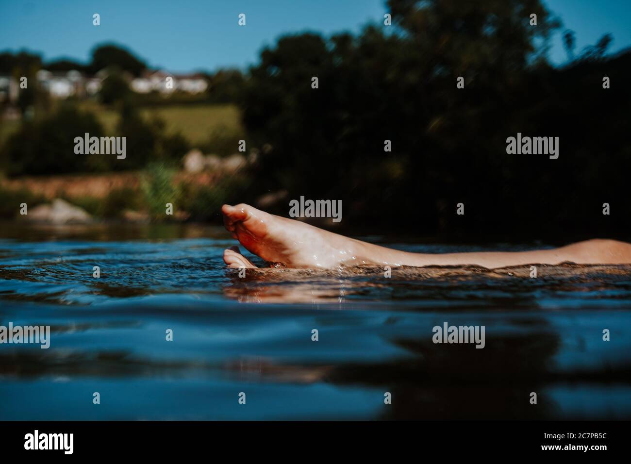 Beautiful woman skinny dipping and wild swimming in river Stock Photo ...