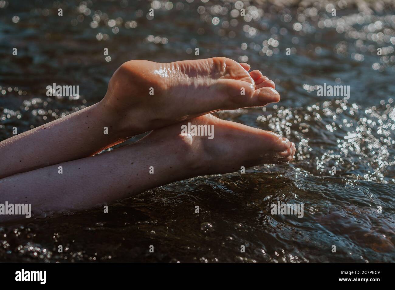 Beautiful woman skinny dipping and wild swimming in river Stock Photo ...