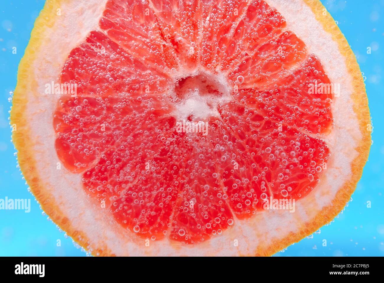red citrus- fruit slices of grapefruit. To close. ripe juicy fruit in ...