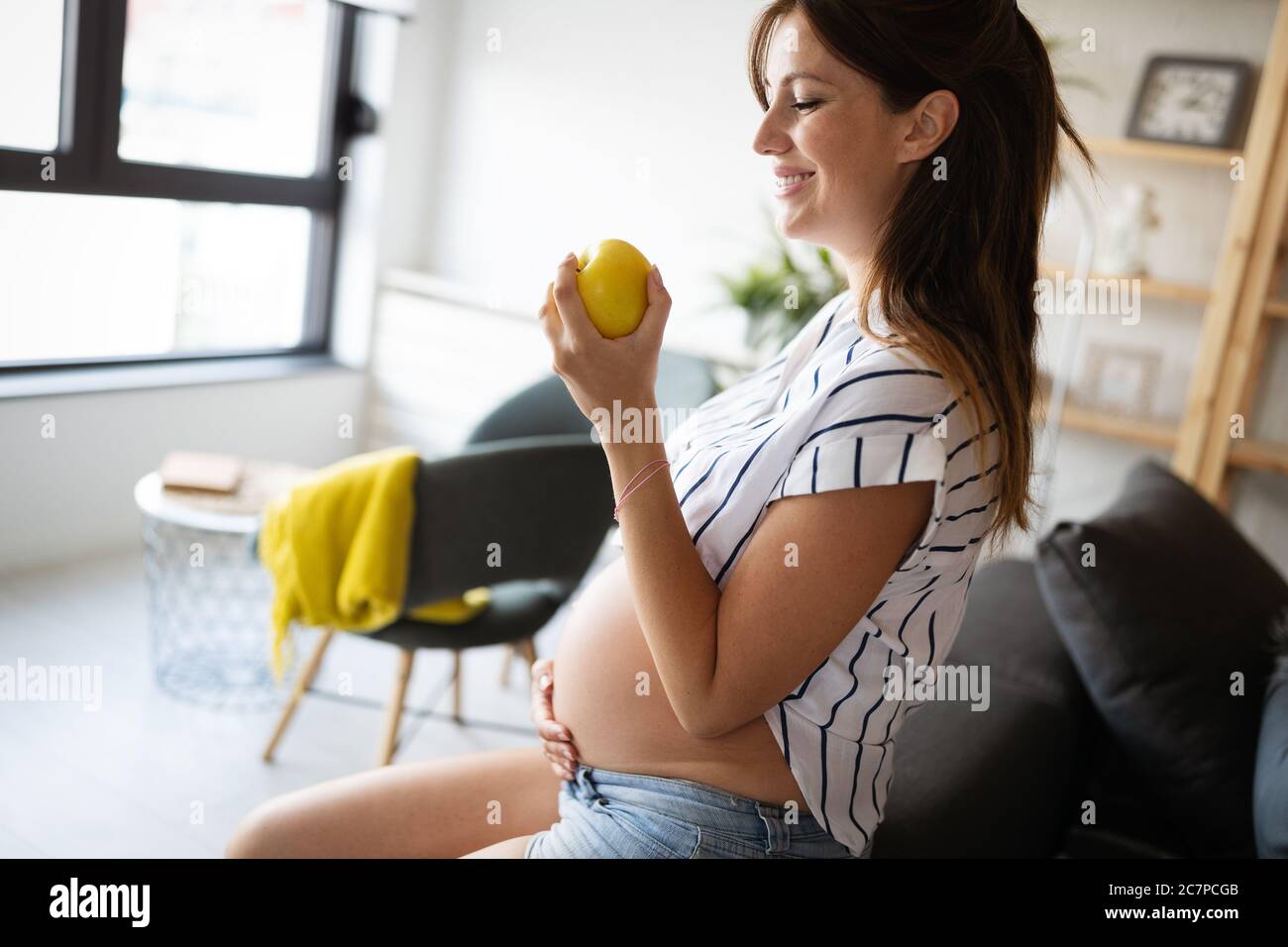 Pregnant woman expecting baby with healthy lifestyle Stock Photo - Alamy