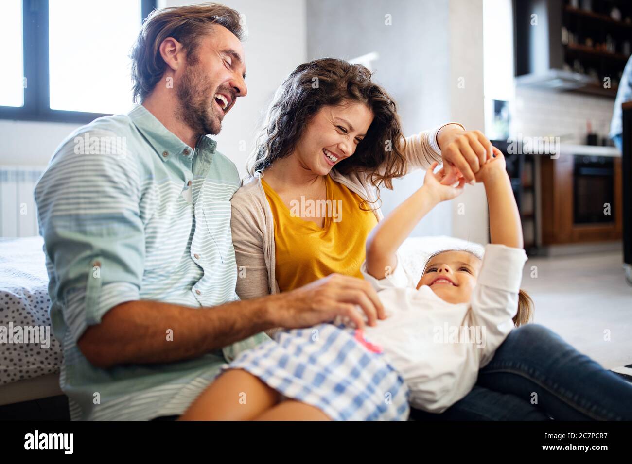 Happy family having fun times at home Stock Photo - Alamy