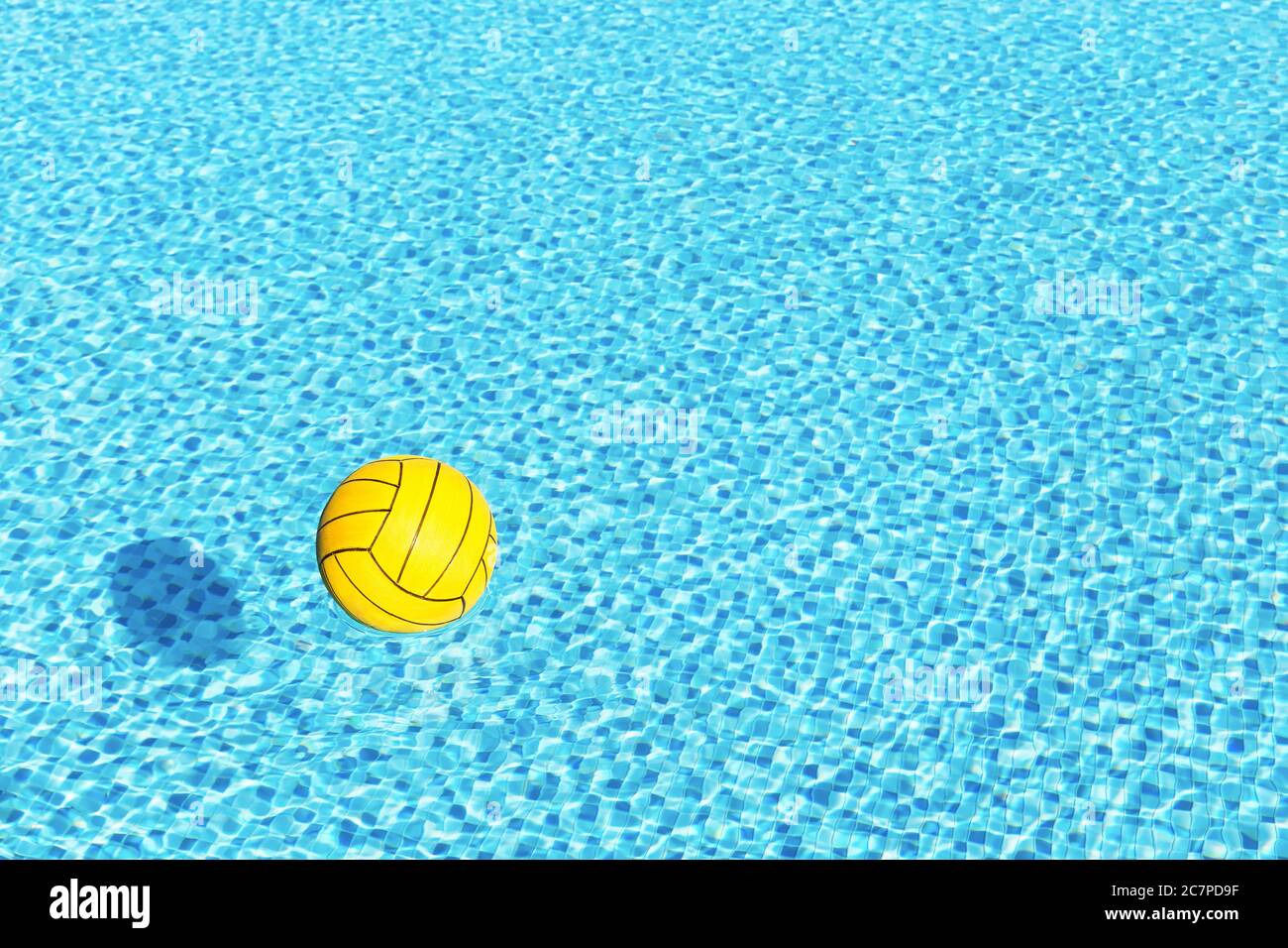 Yellow pool ball in a blue swimming pool Stock Photo - Alamy