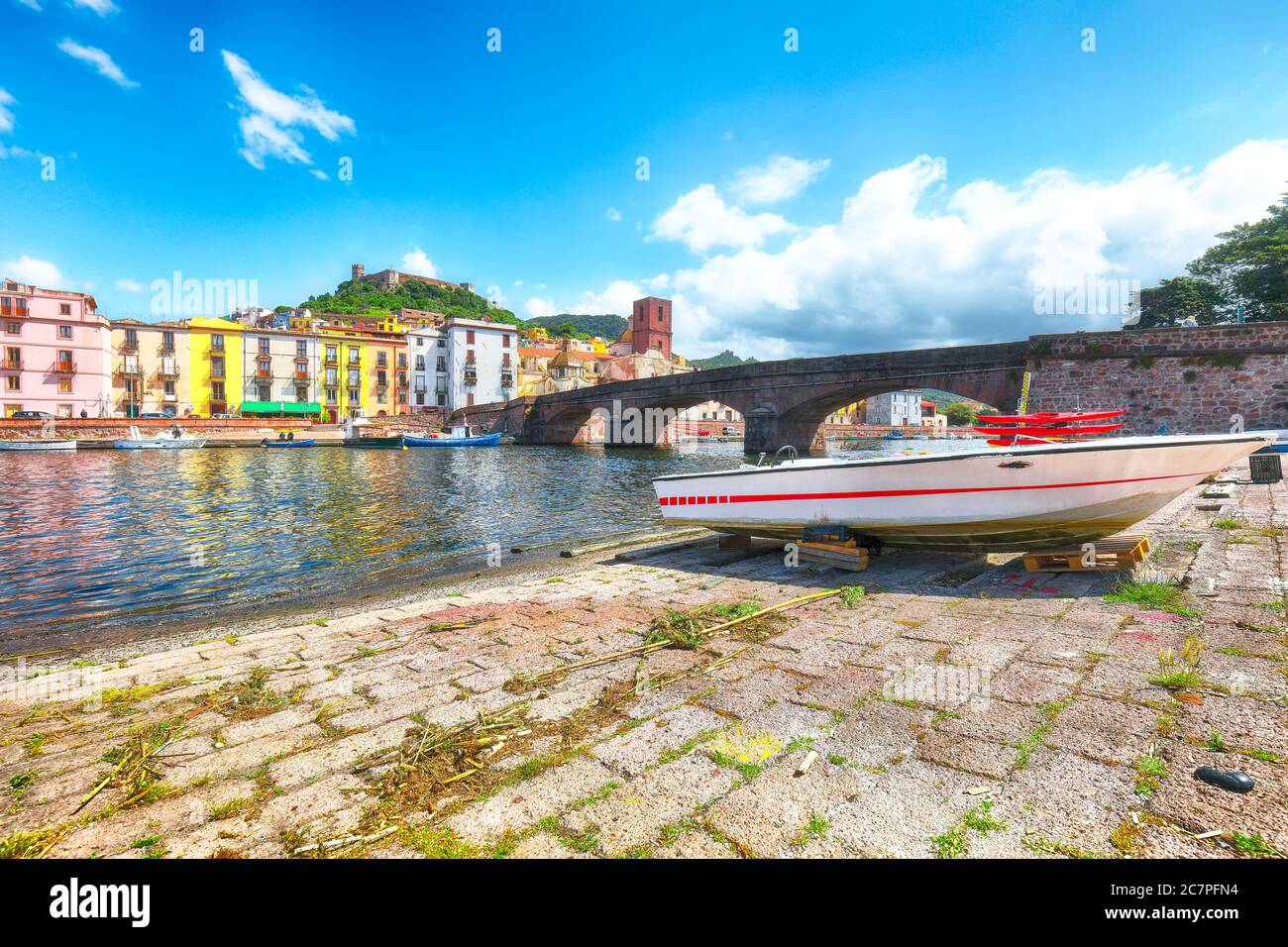 Astonishing cityscape of Bosa town with Ponte Vecchio bridge across the ...