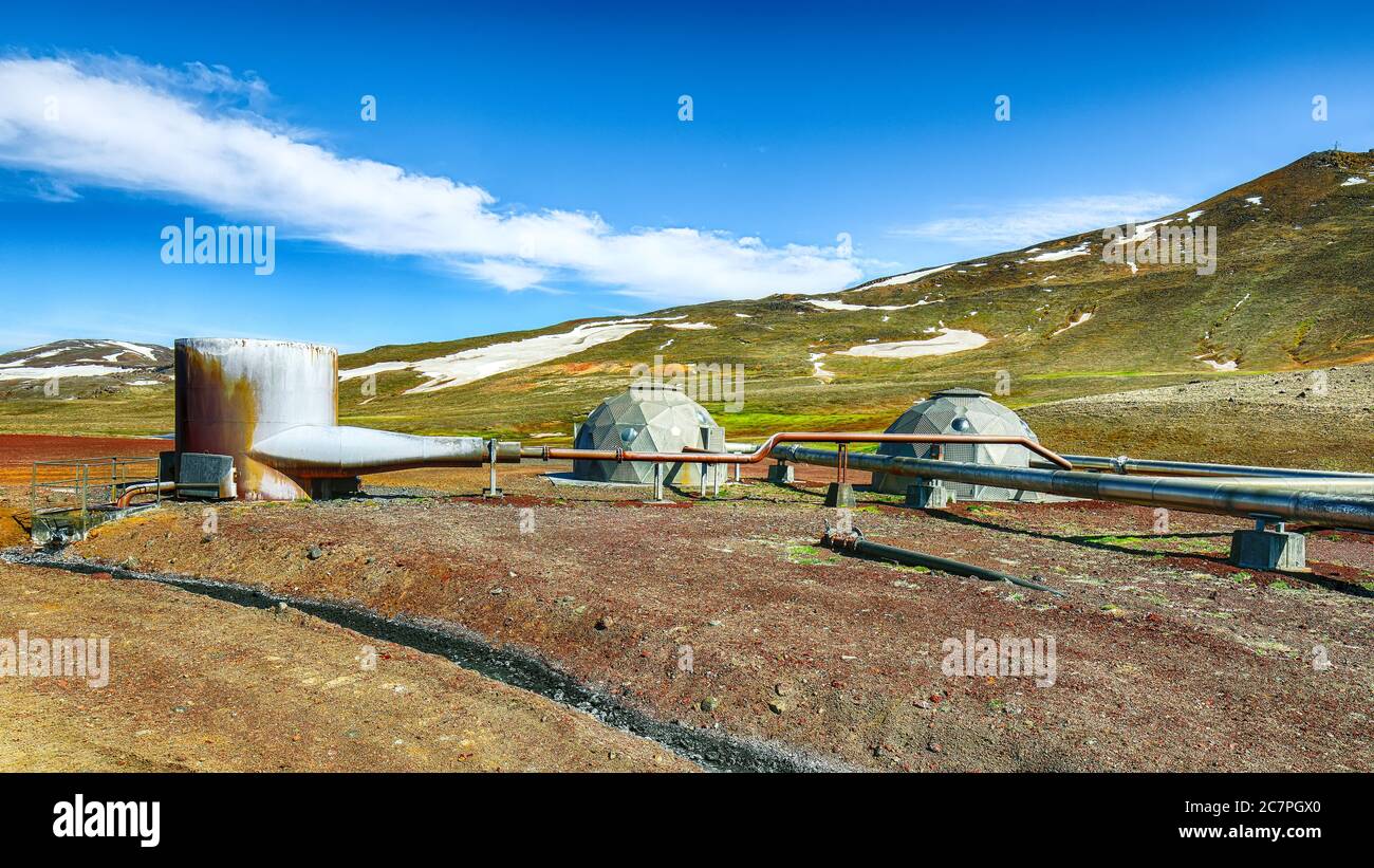 Icelandic landscape with geothermal power plant station and pipes ...