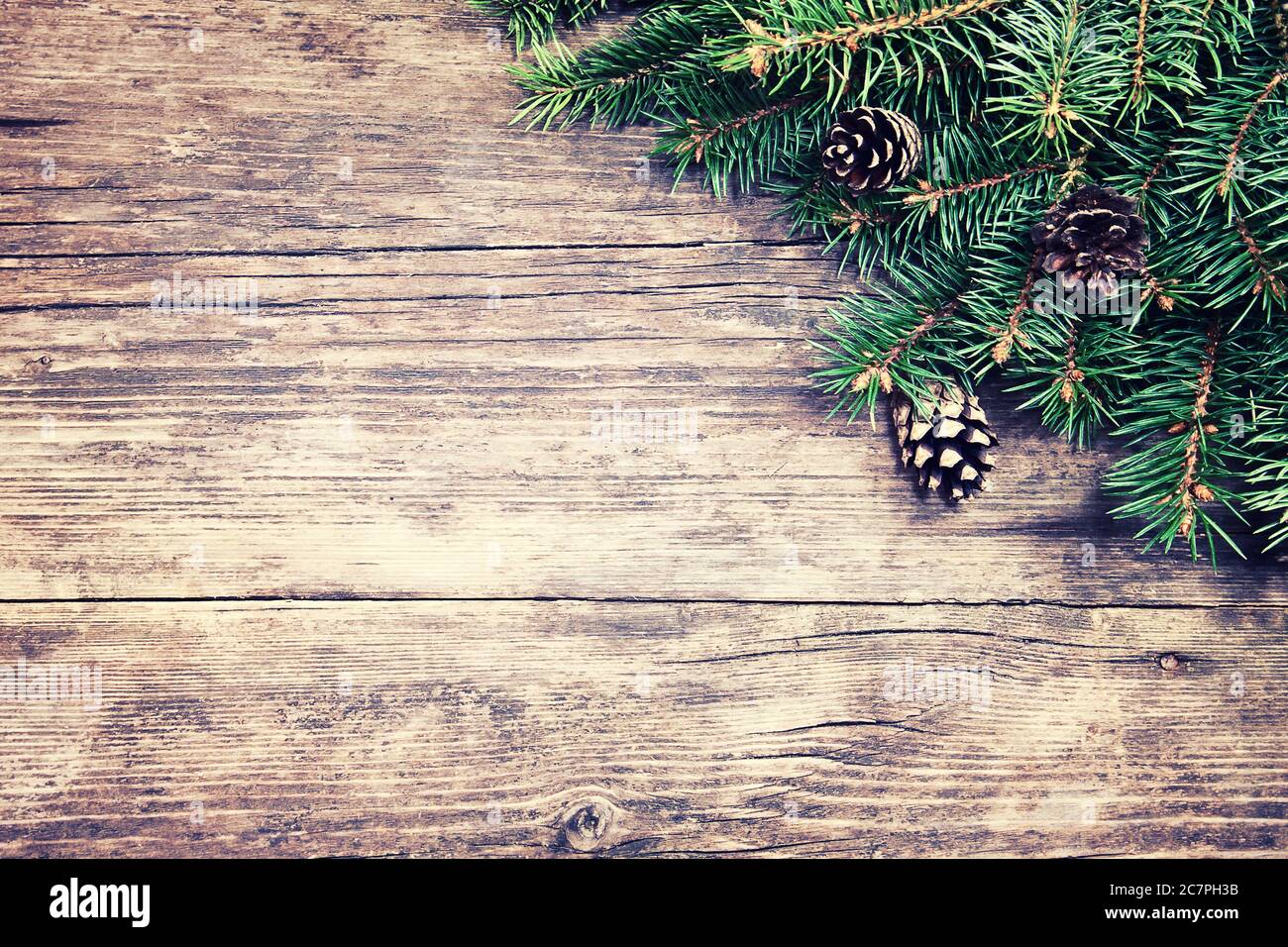 Christmas fir tree on a wooden background Stock Photo - Alamy