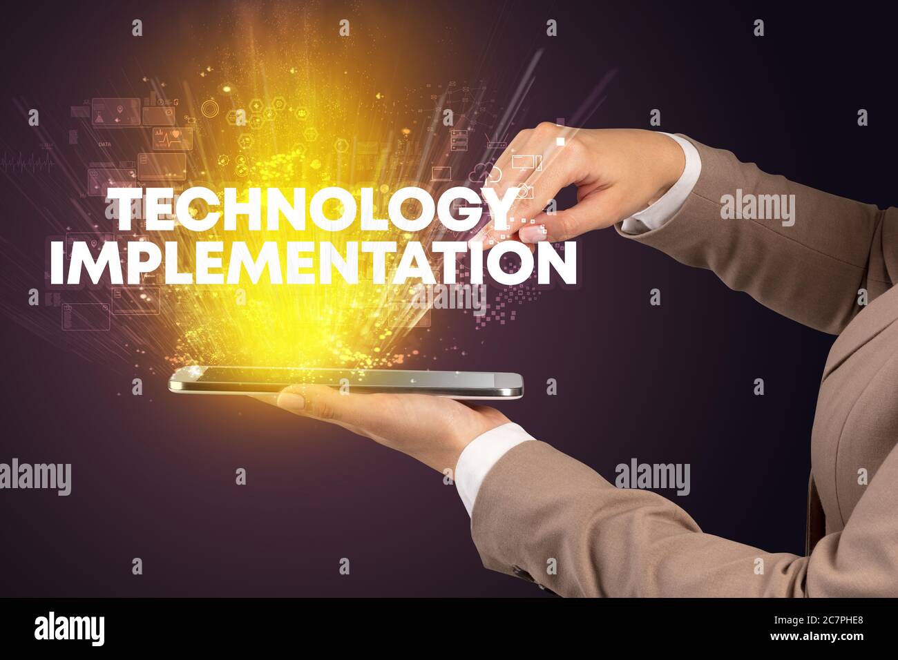 Close-up of a touchscreen with TECHNOLOGY IMPLEMENTATION inscription ...