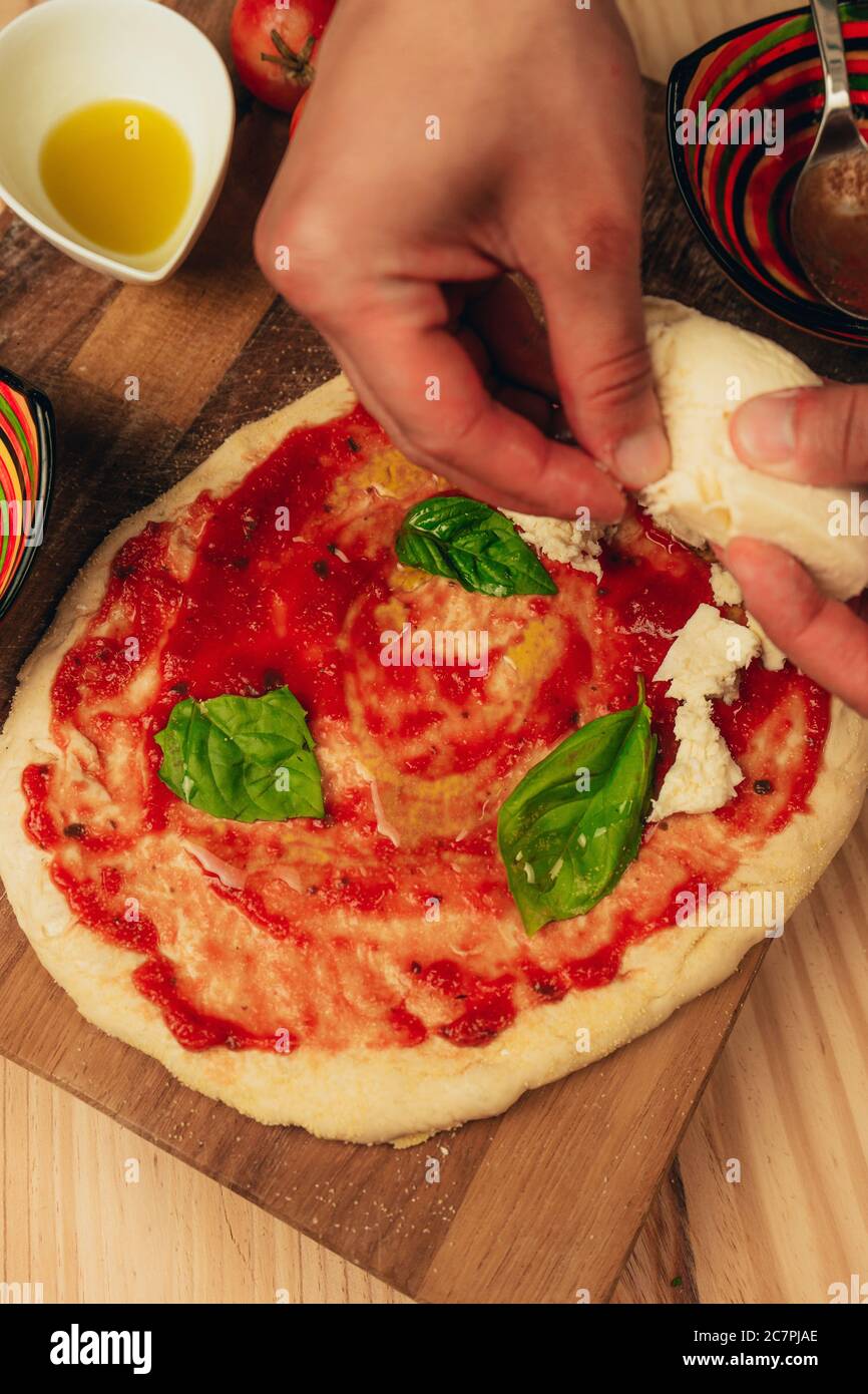Pizza making closeup green hi-res stock photography and images - Alamy
