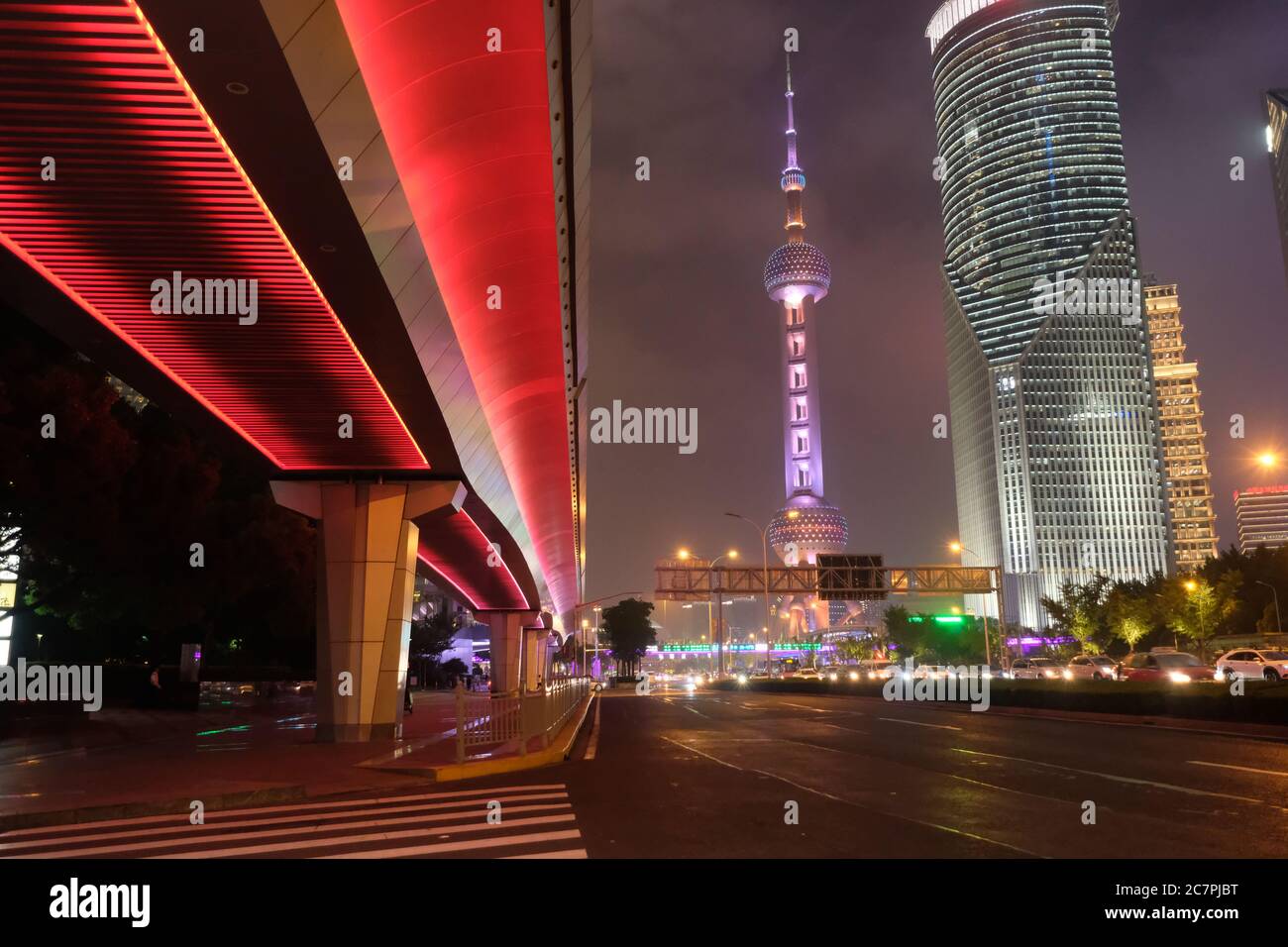 night scene of modern Shanghai Pudong. Highway under shining red ...