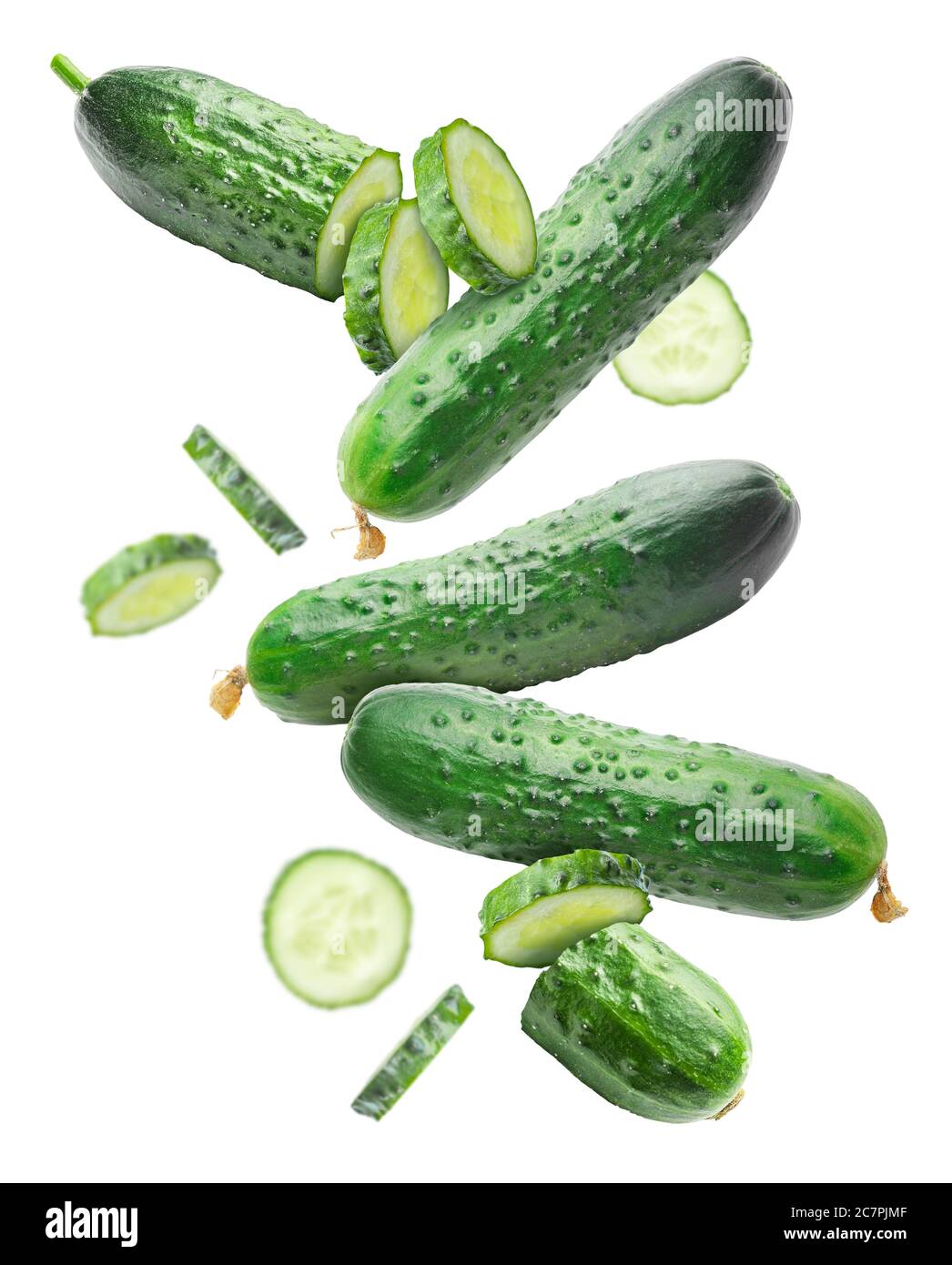 Flying green cucumbers on white background Stock Photo - Alamy