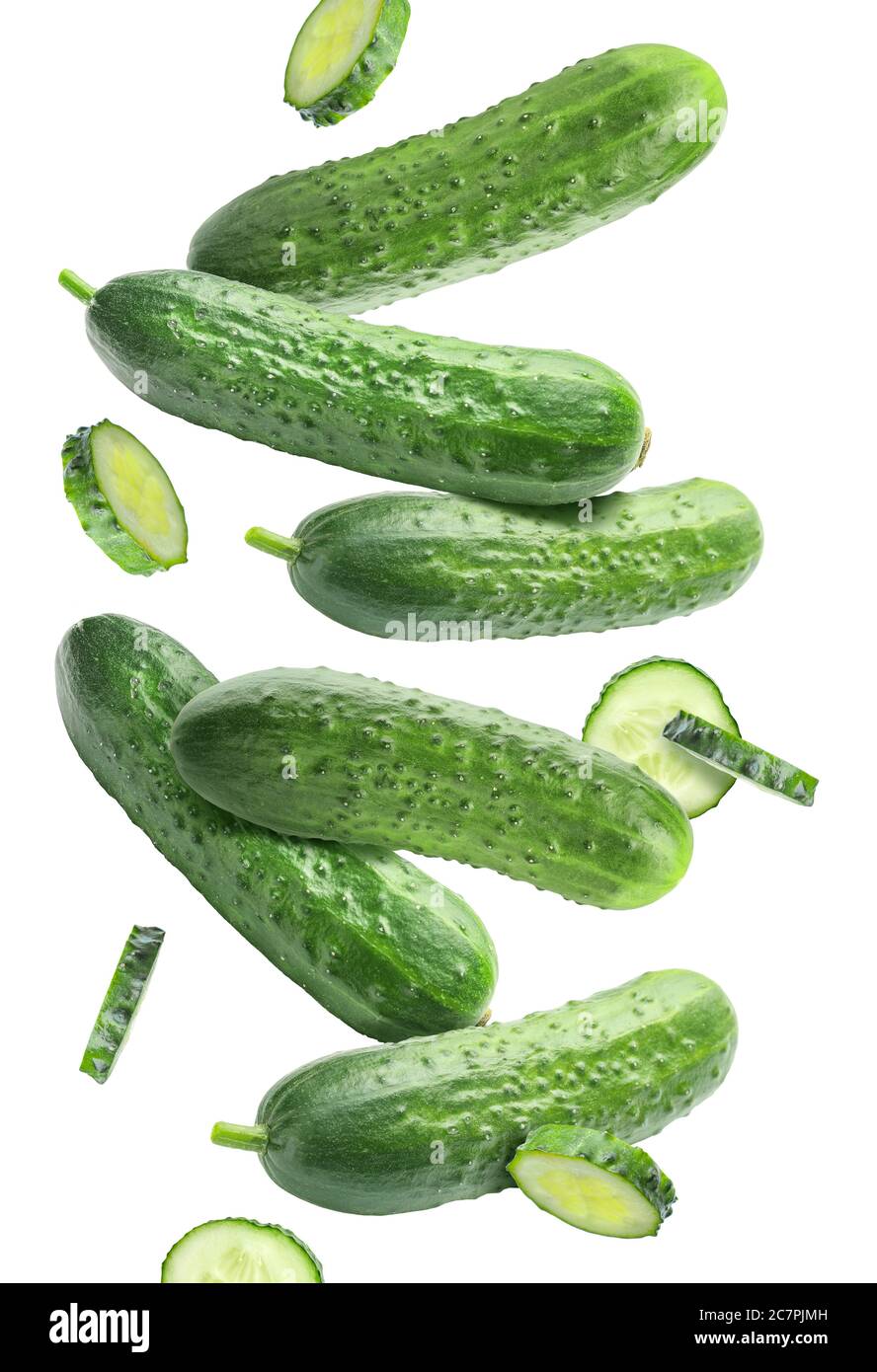 Flying green cucumbers on white background Stock Photo - Alamy