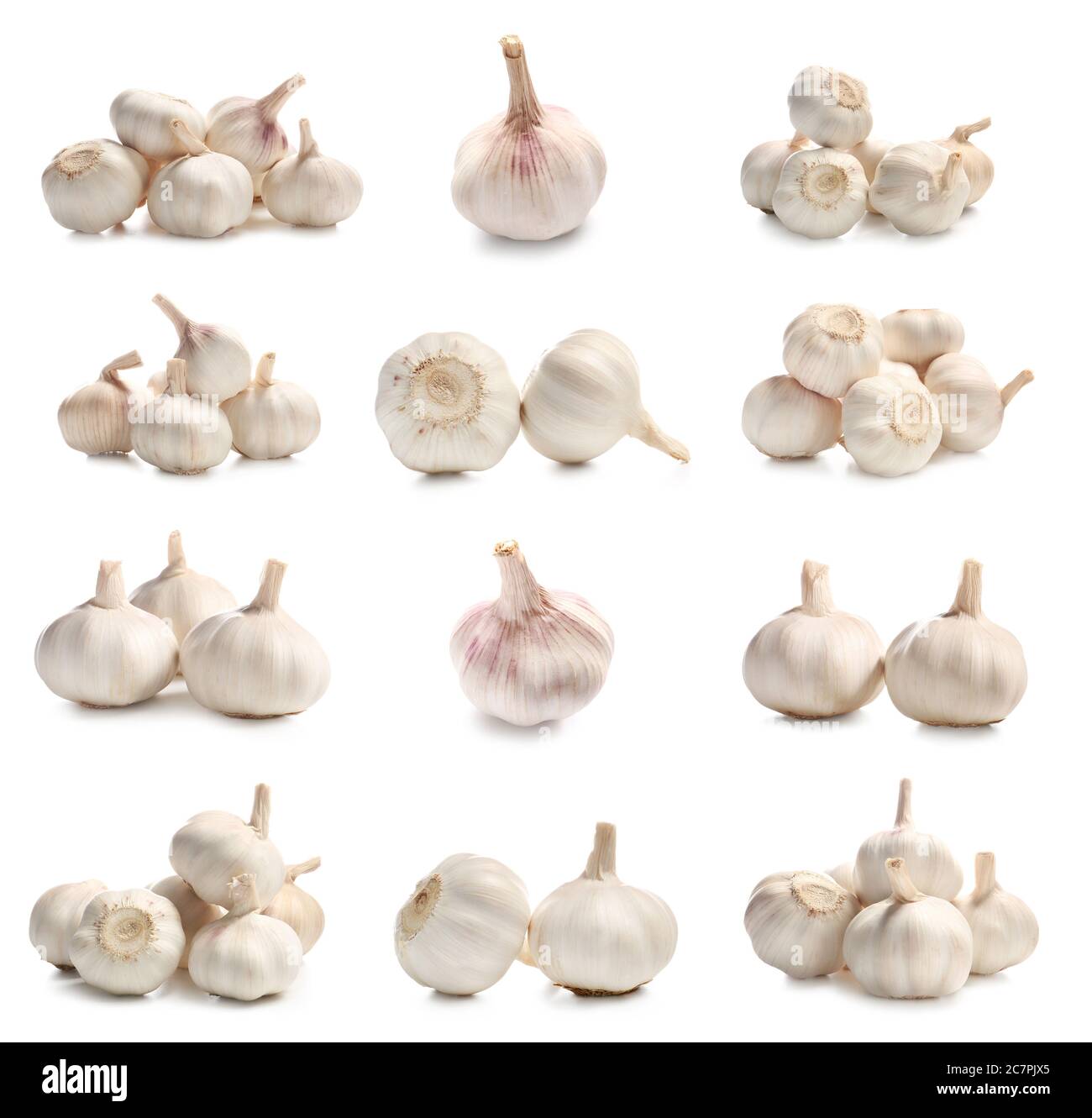Many fresh garlic on white background Stock Photo - Alamy