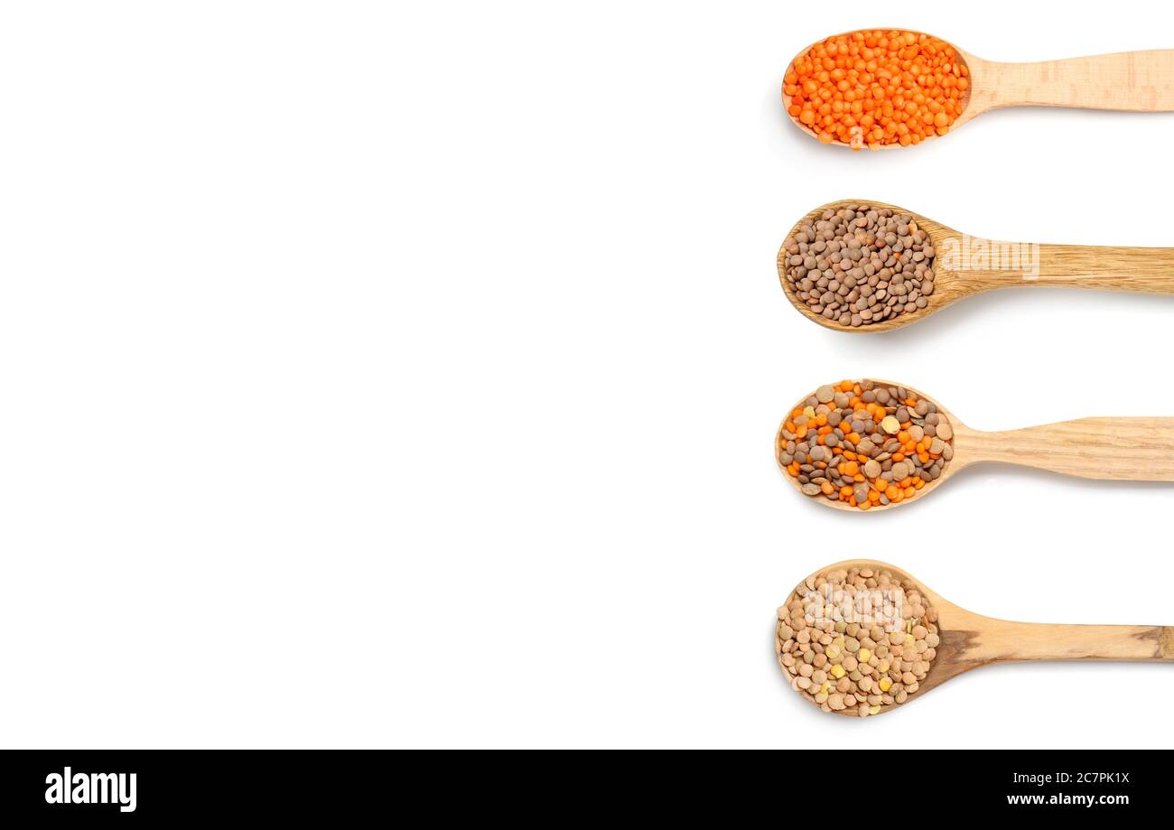 Spoons with different raw lentils on white background Stock Photo - Alamy