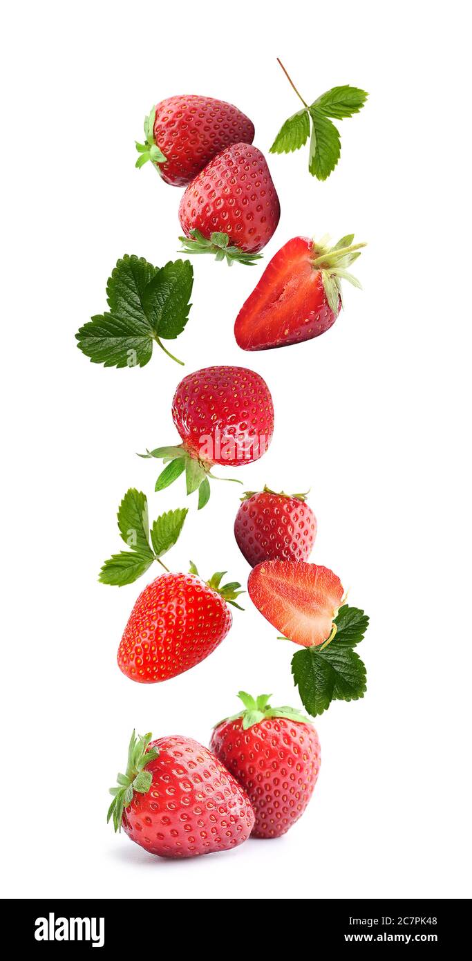 Ripe falling strawberry on white background Stock Photo - Alamy