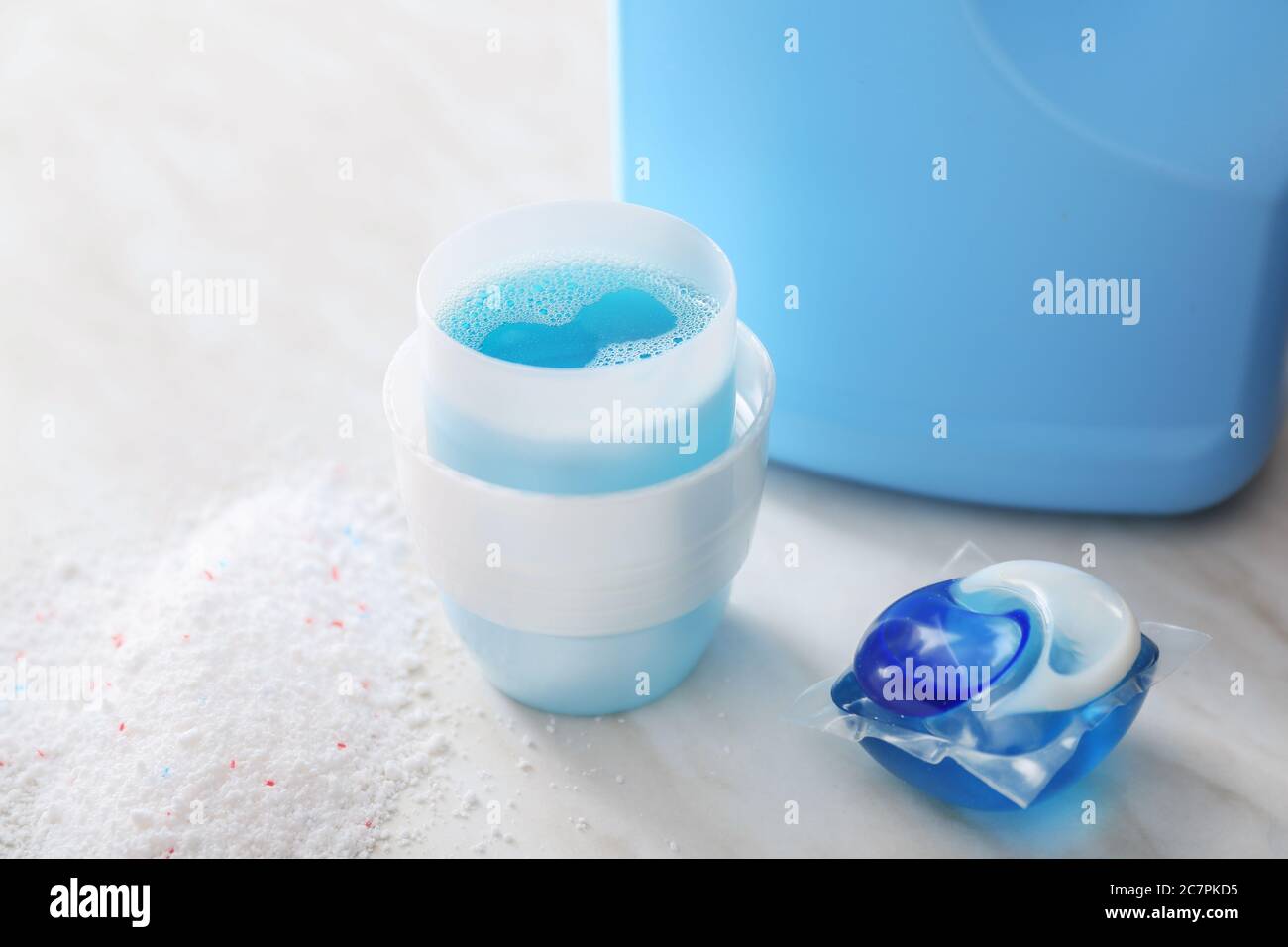 Laundry detergents on white background Stock Photo - Alamy
