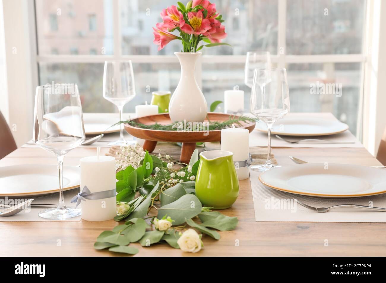 Beautiful table setting in dining room Stock Photo - Alamy