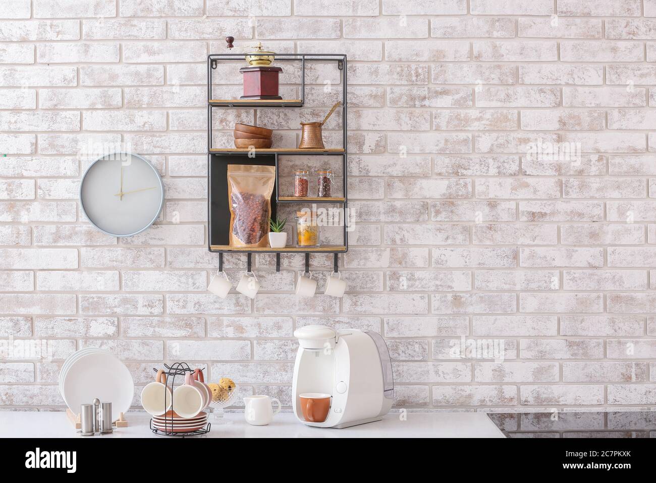 Hanging shelves on brick wall hi-res stock photography and images - Alamy