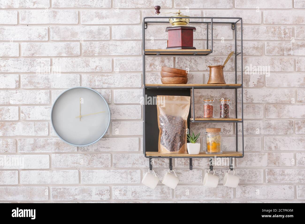 Hanging shelves on brick wall hi-res stock photography and images - Alamy