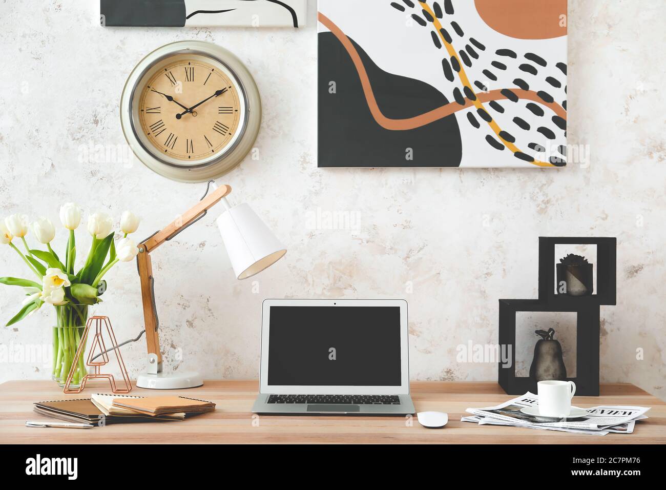 Modern workplace with laptop in room Stock Photo - Alamy