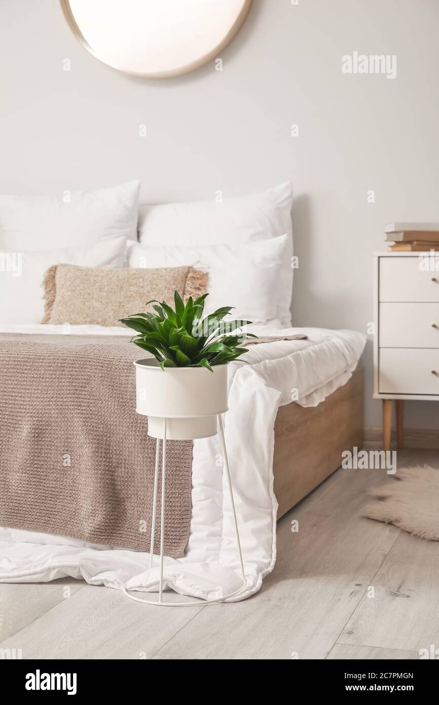 Big comfortable bed in room Stock Photo - Alamy