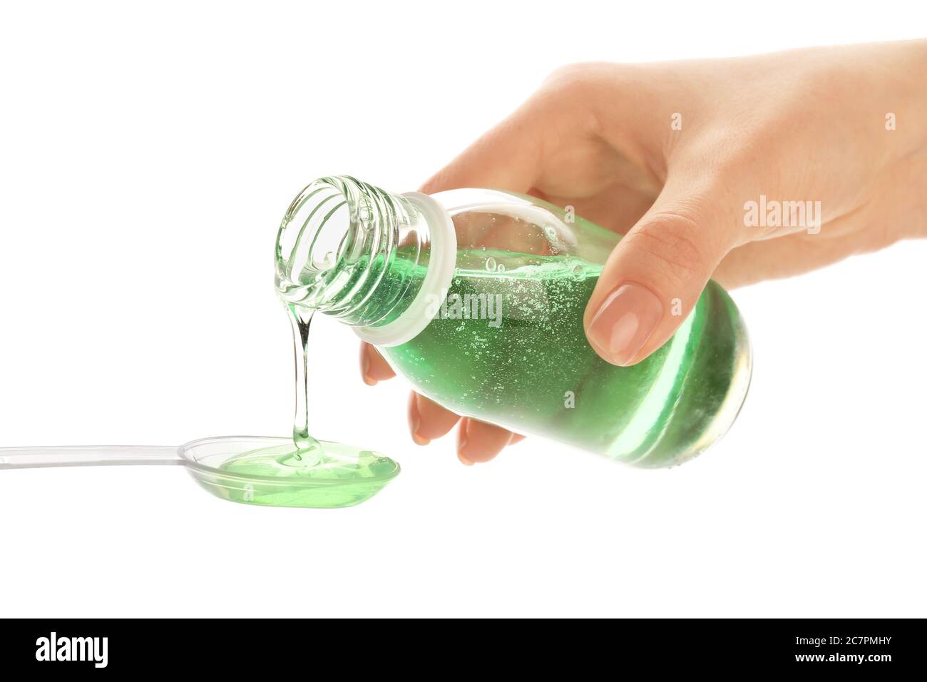 Female hand pouring medicine syrup Cut Out Stock Images & Pictures - Alamy