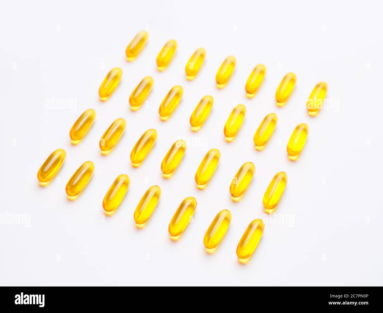 Fish oil capsules on white background Stock Photo - Alamy