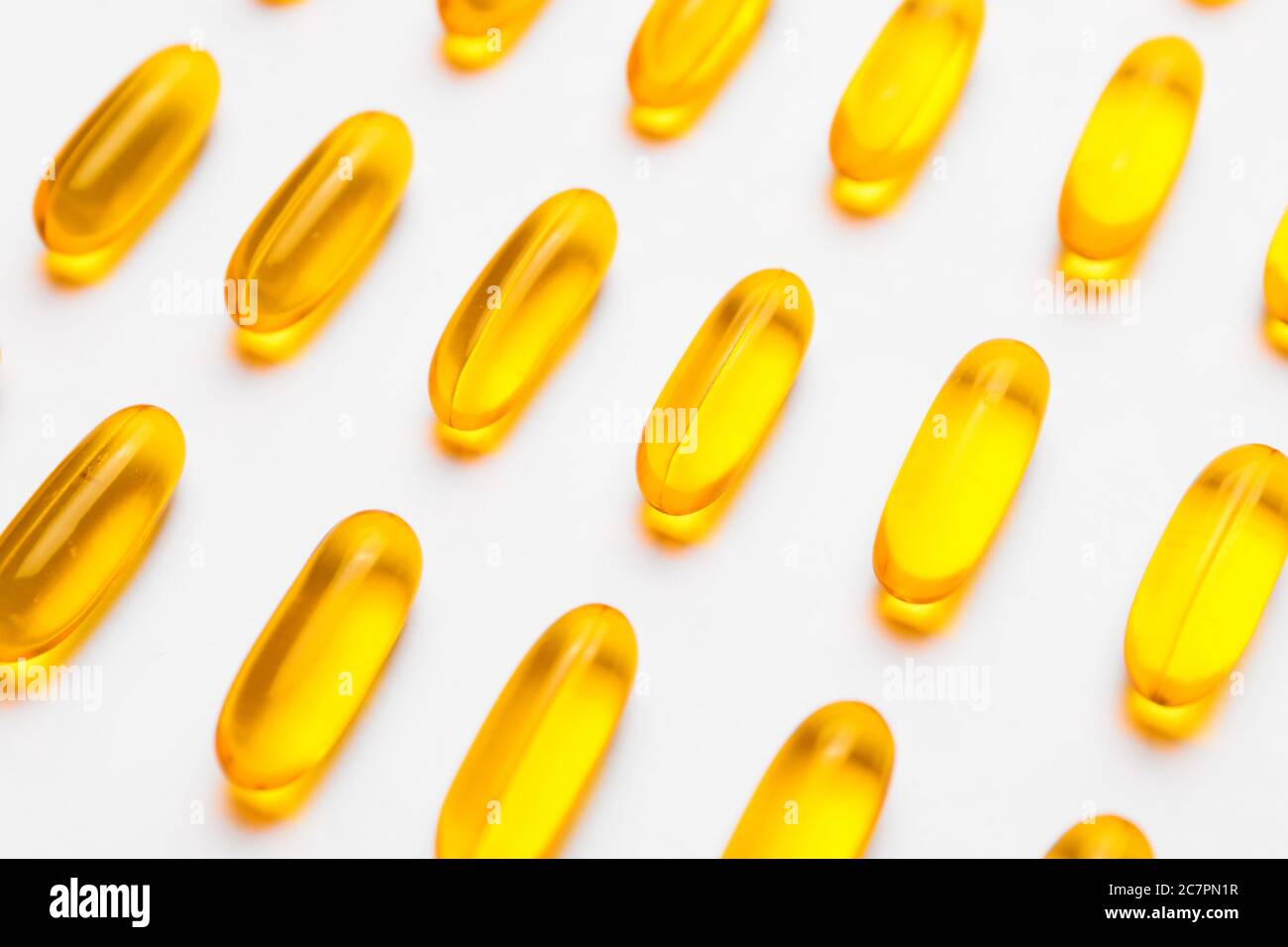 Fish oil capsules on white background Stock Photo - Alamy