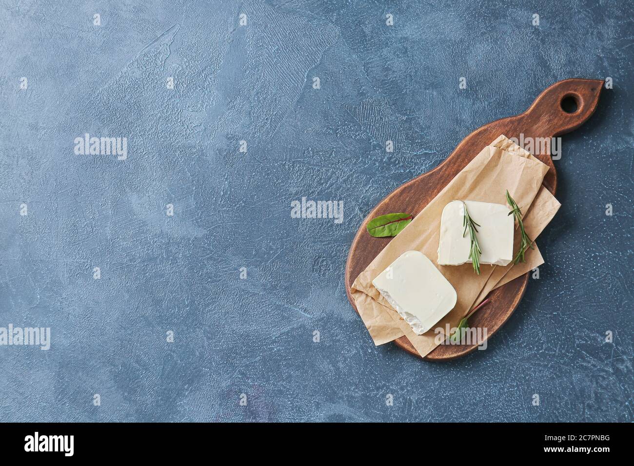 Tasty feta cheese on dark background Stock Photo - Alamy