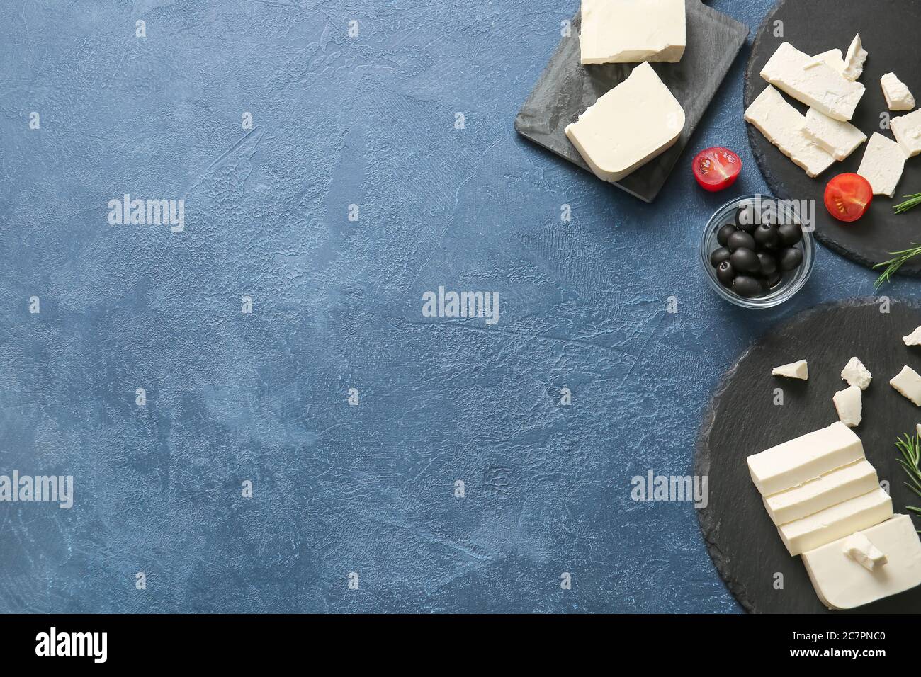 Tasty feta cheese with olives on dark background Stock Photo - Alamy