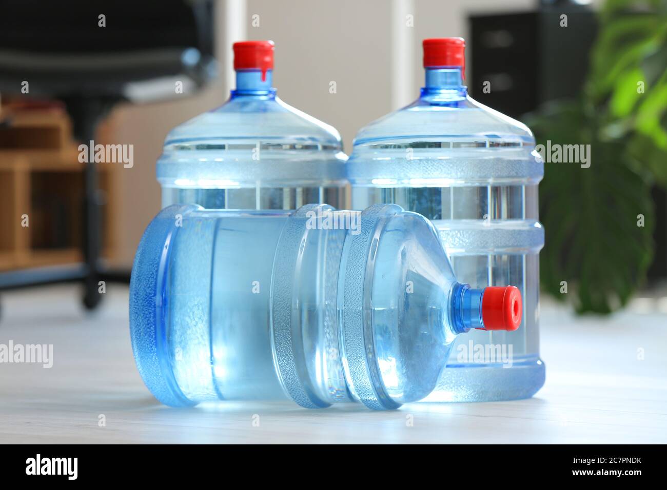 Bottles of fresh water in office Stock Photo - Alamy