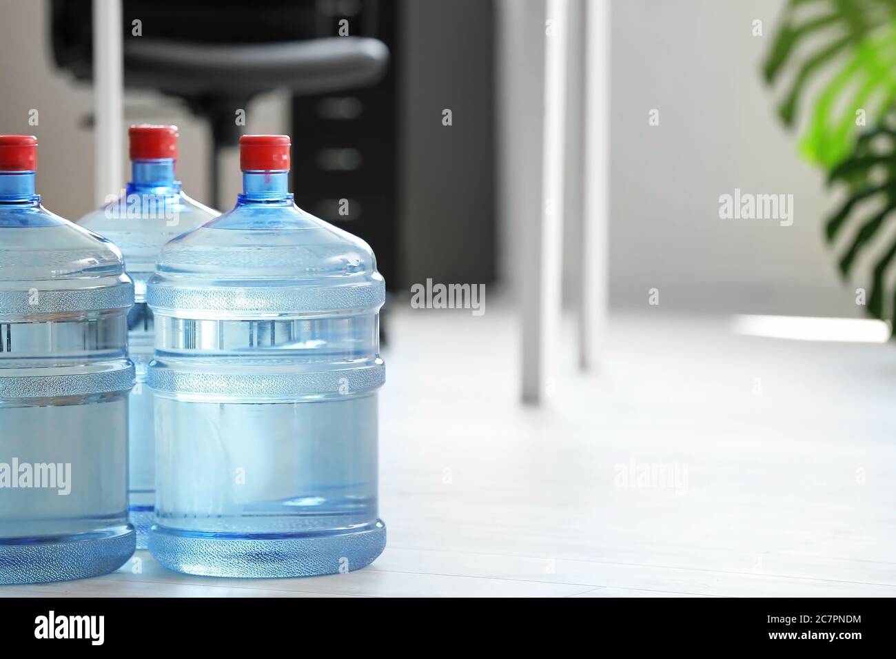 Bottles of fresh water in office Stock Photo - Alamy