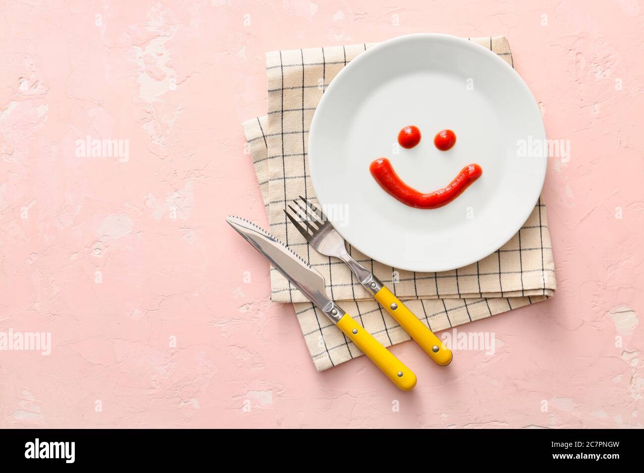Happy face made of sauce on plate Stock Photo - Alamy