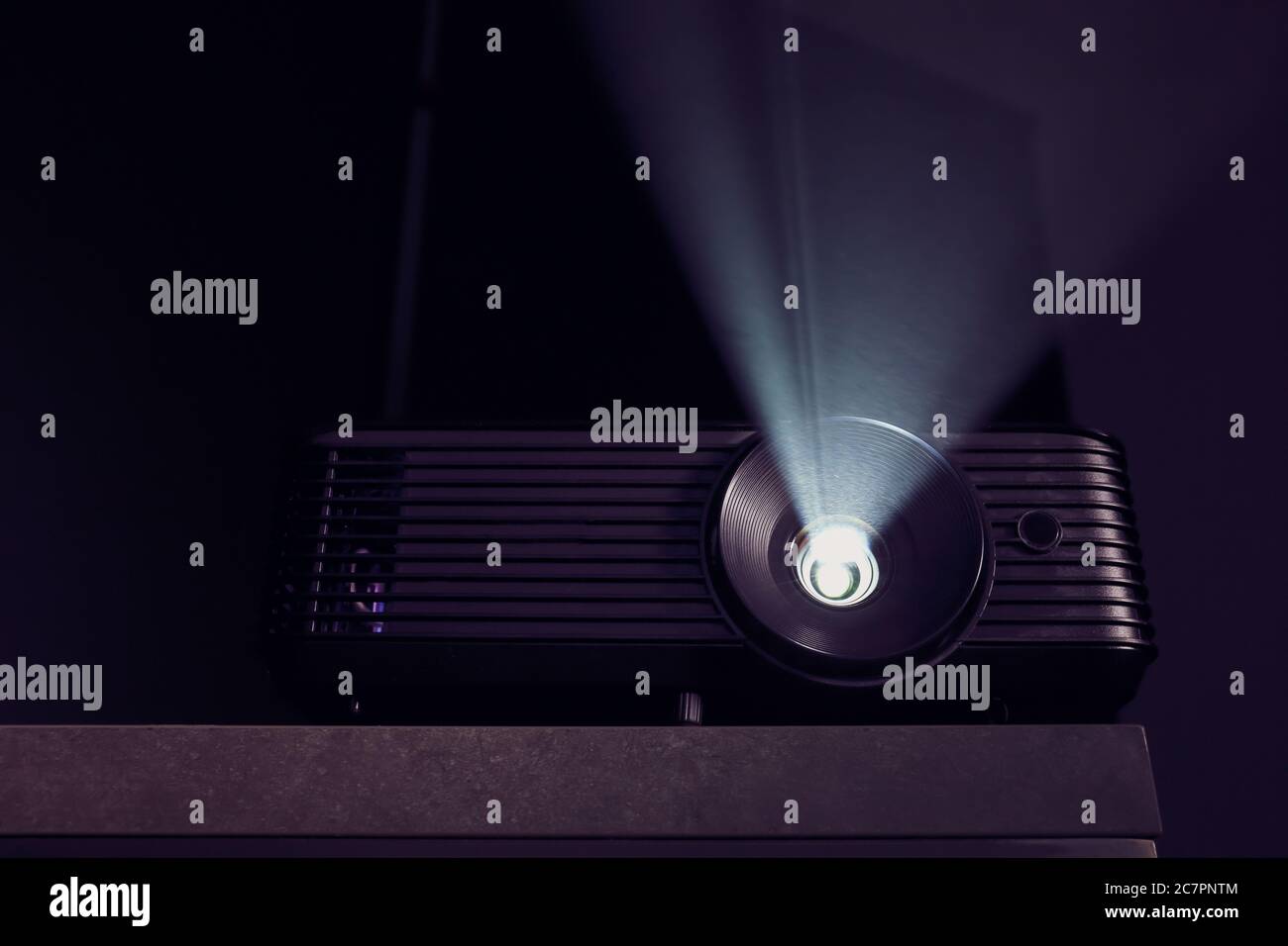 Modern video projector on dark background Stock Photo - Alamy