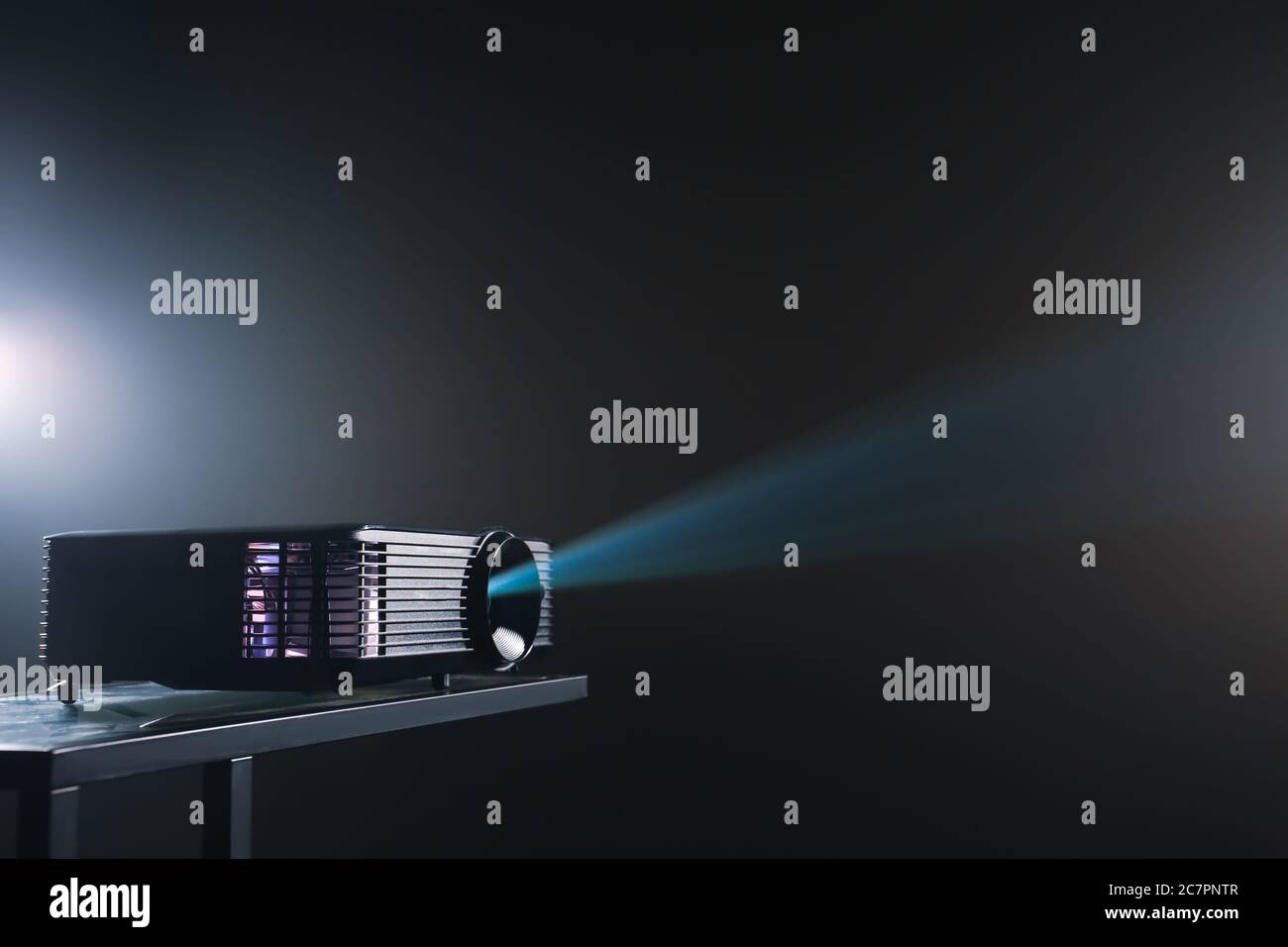 Modern video projector on dark background Stock Photo - Alamy
