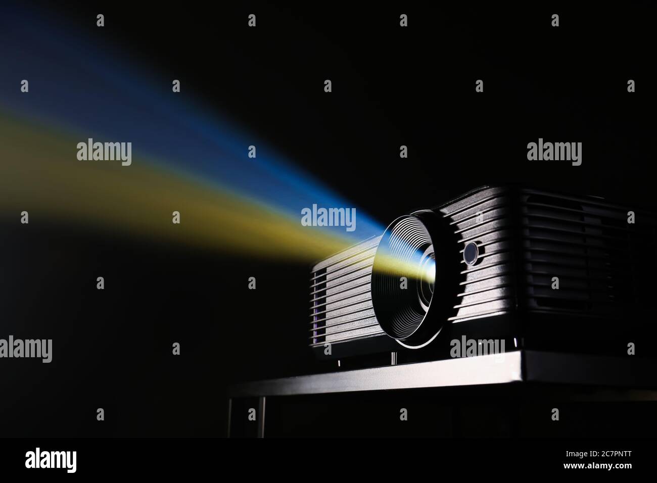 Modern video projector on dark background Stock Photo - Alamy