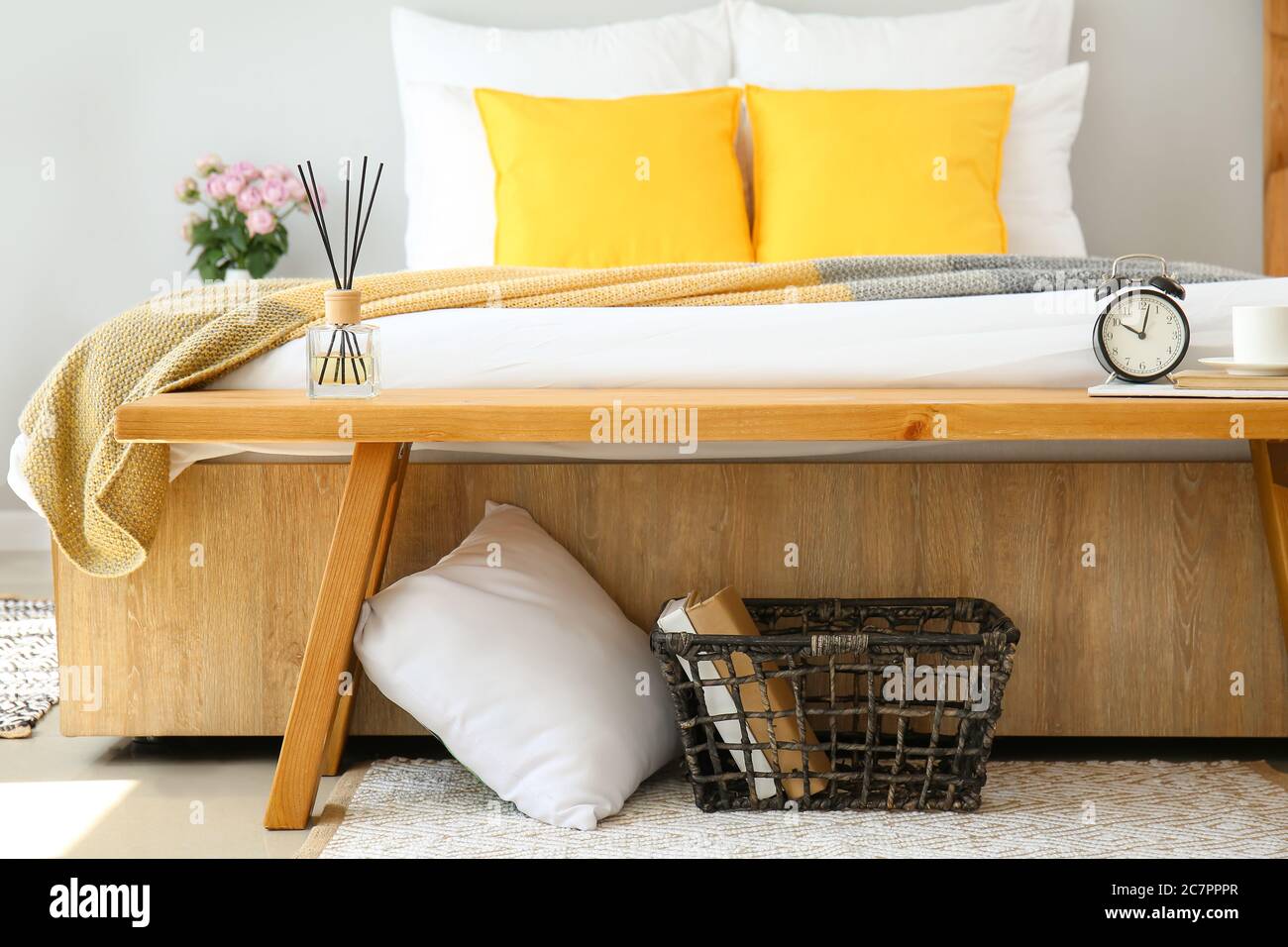 Big bed and bench in interior of modern room Stock Photo - Alamy