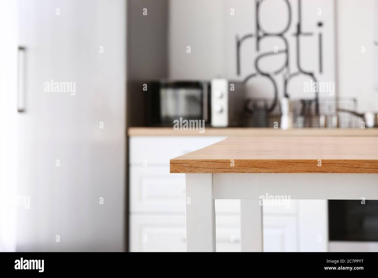 Empty table in modern kitchen Stock Photo - Alamy