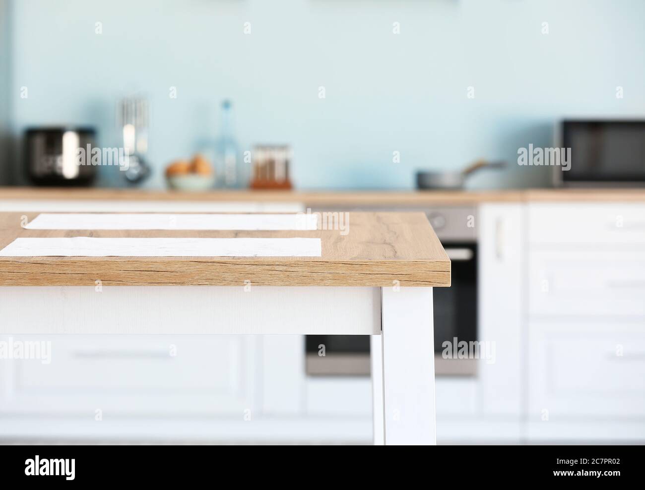 Empty table in modern kitchen Stock Photo - Alamy