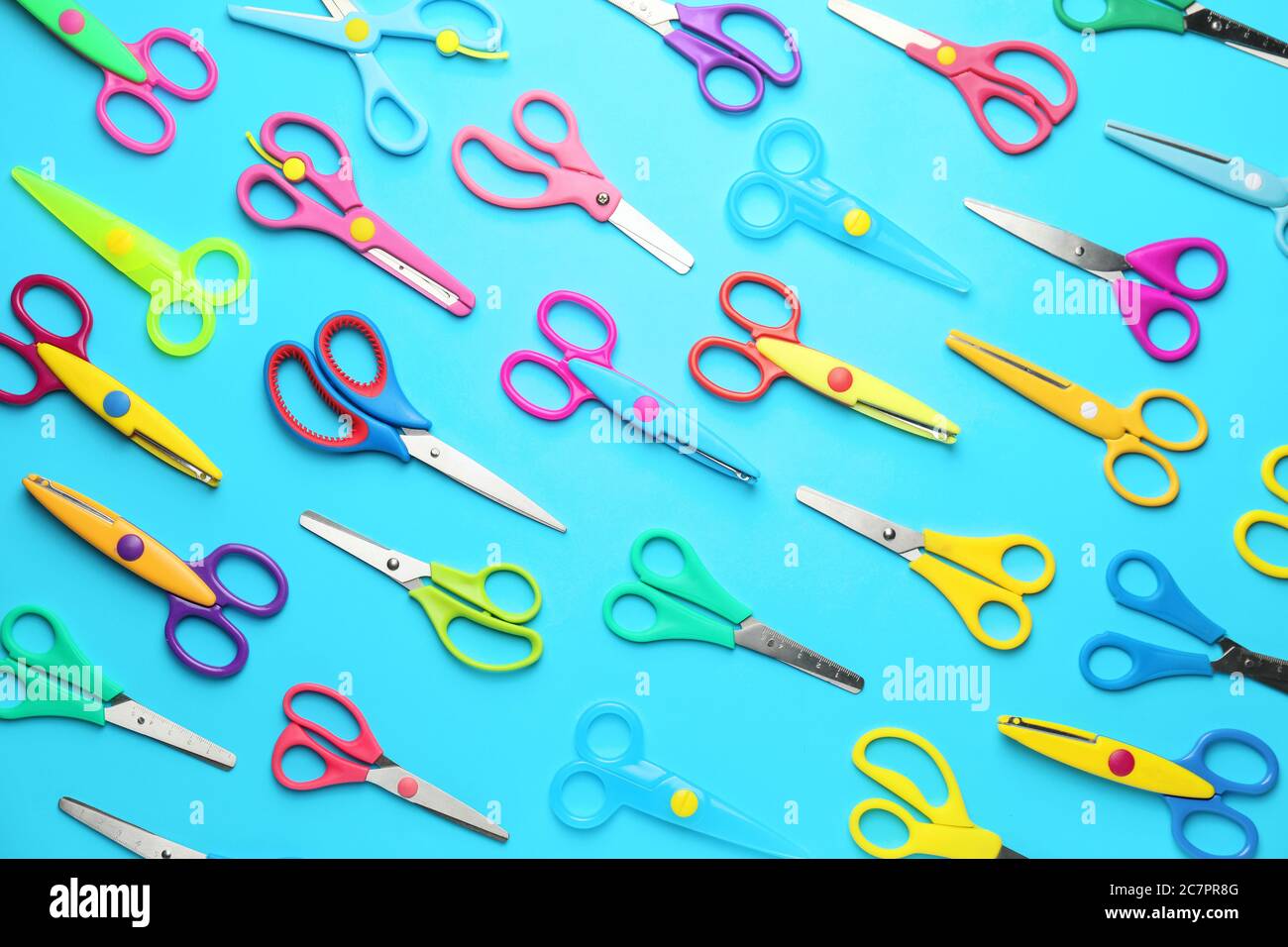 Scissors for paper on color background Stock Photo - Alamy