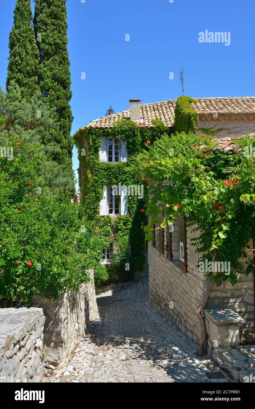 Narrow medieval street in small village Seguret, one from list of most ...