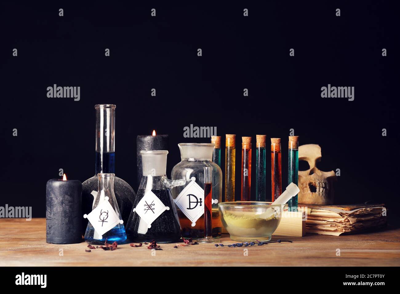 Different potions on alchemist's table Stock Photo - Alamy