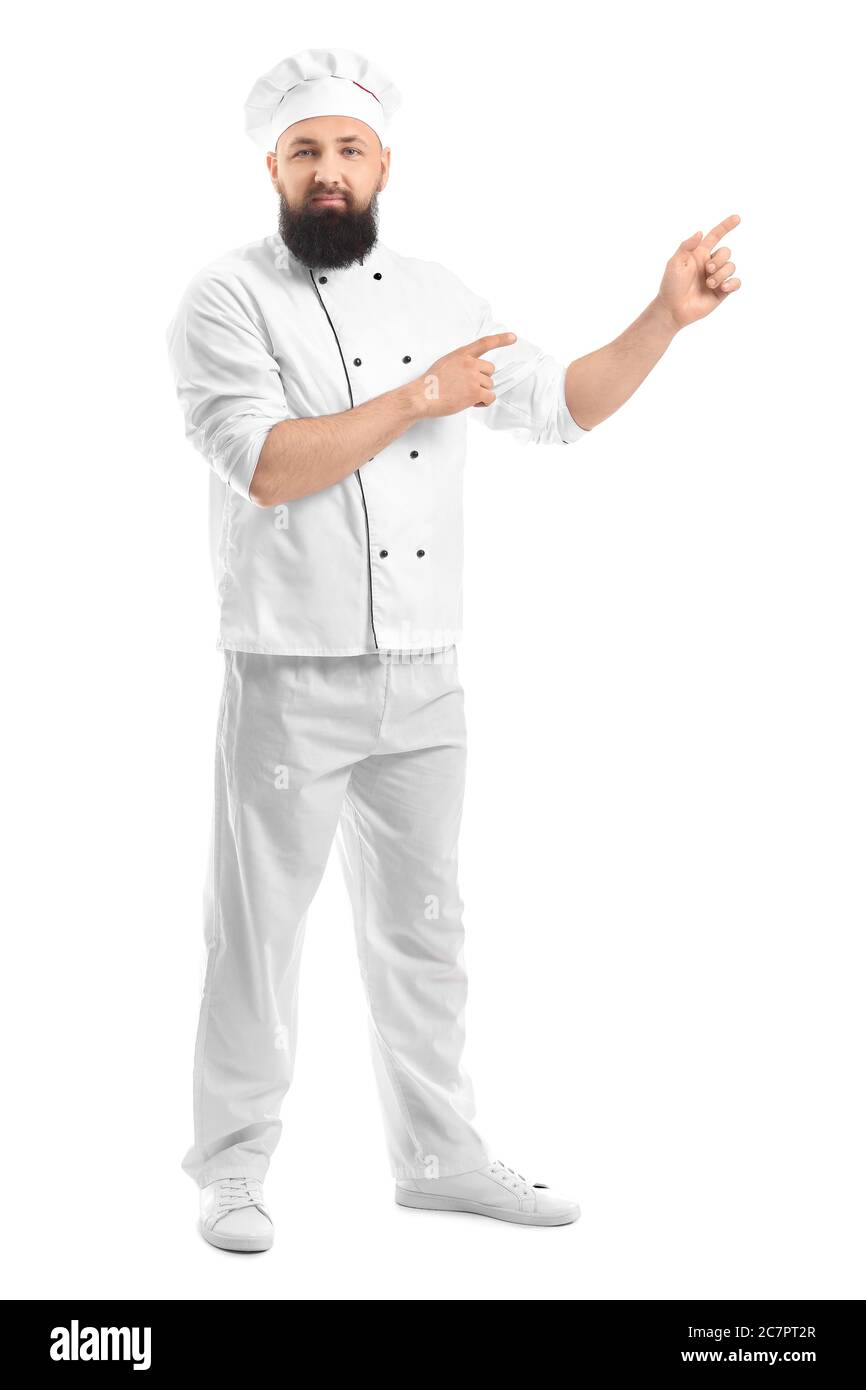 Handsome male chef pointing at something on white background Stock ...