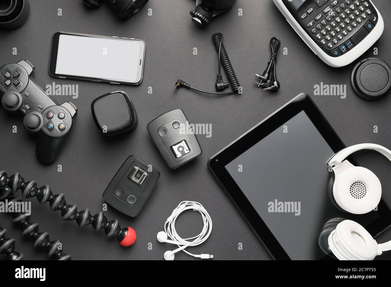 Different modern devices on dark background Stock Photo - Alamy