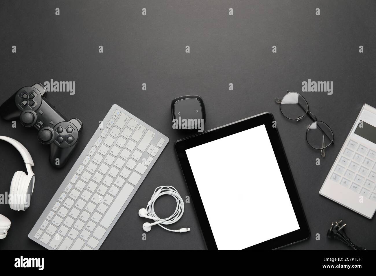 Different modern devices on dark background Stock Photo - Alamy