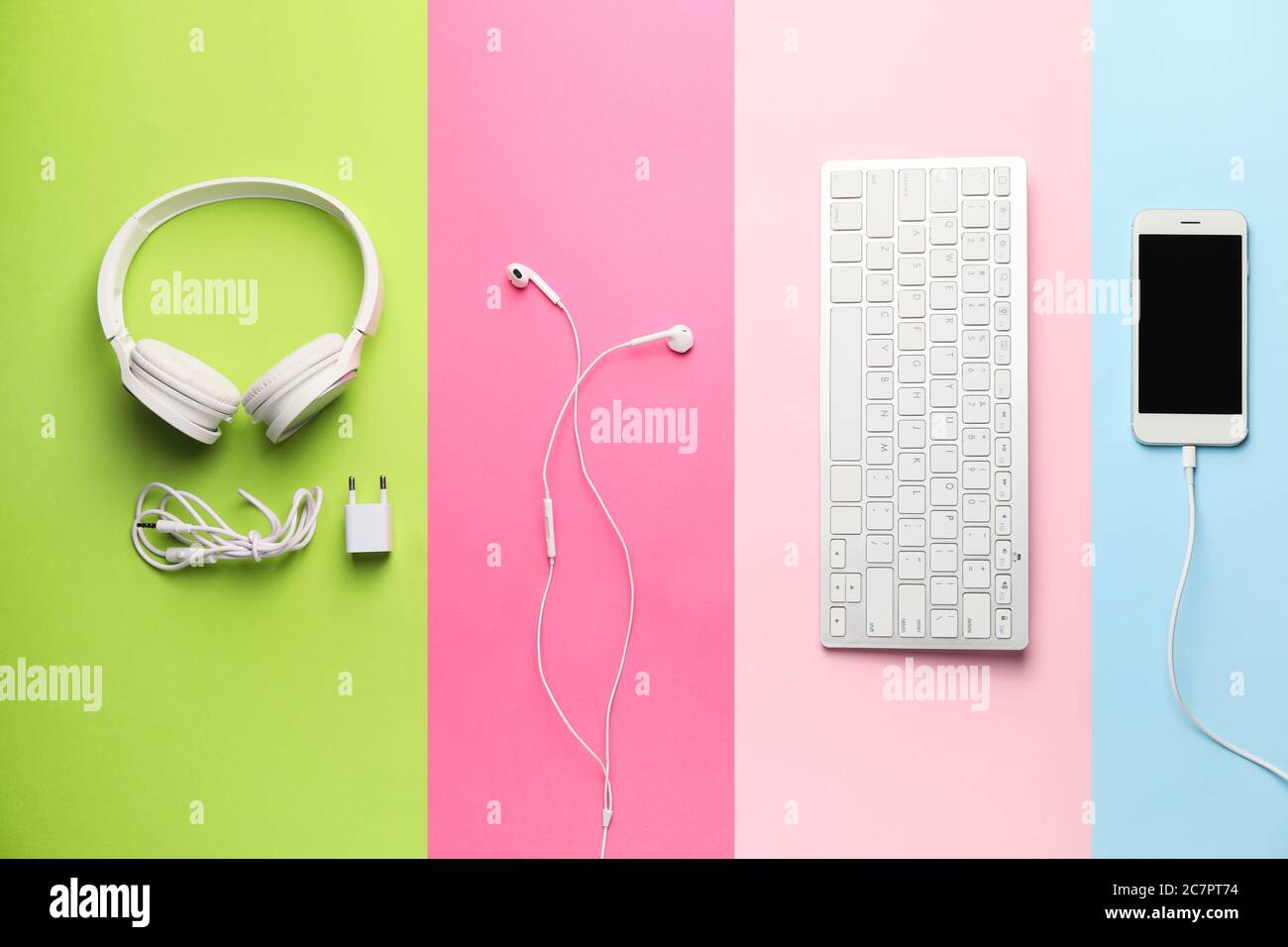 Different modern devices on color background Stock Photo - Alamy